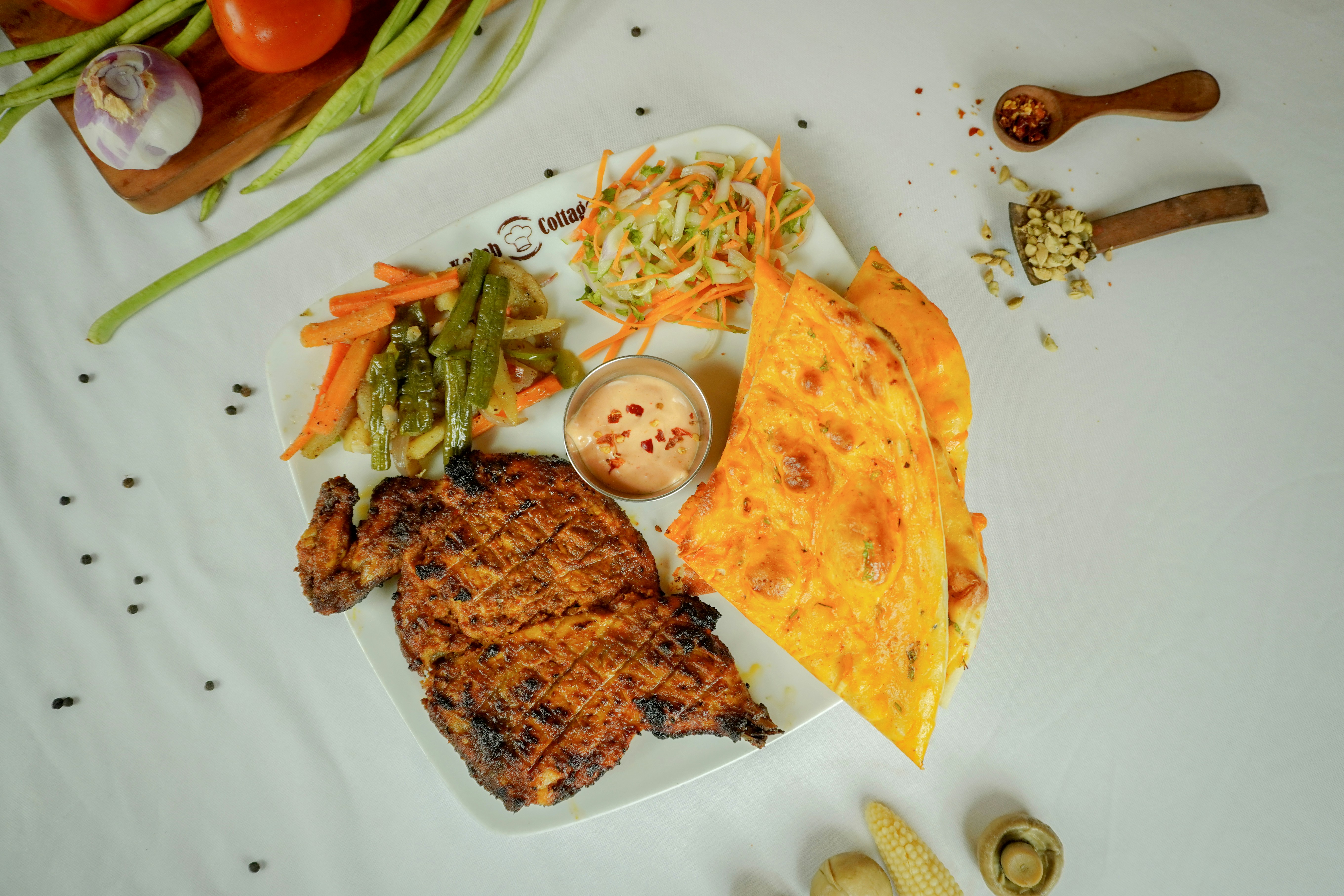 Charred steak, golden flatbread, and crisp slaw: a rustic plated trio