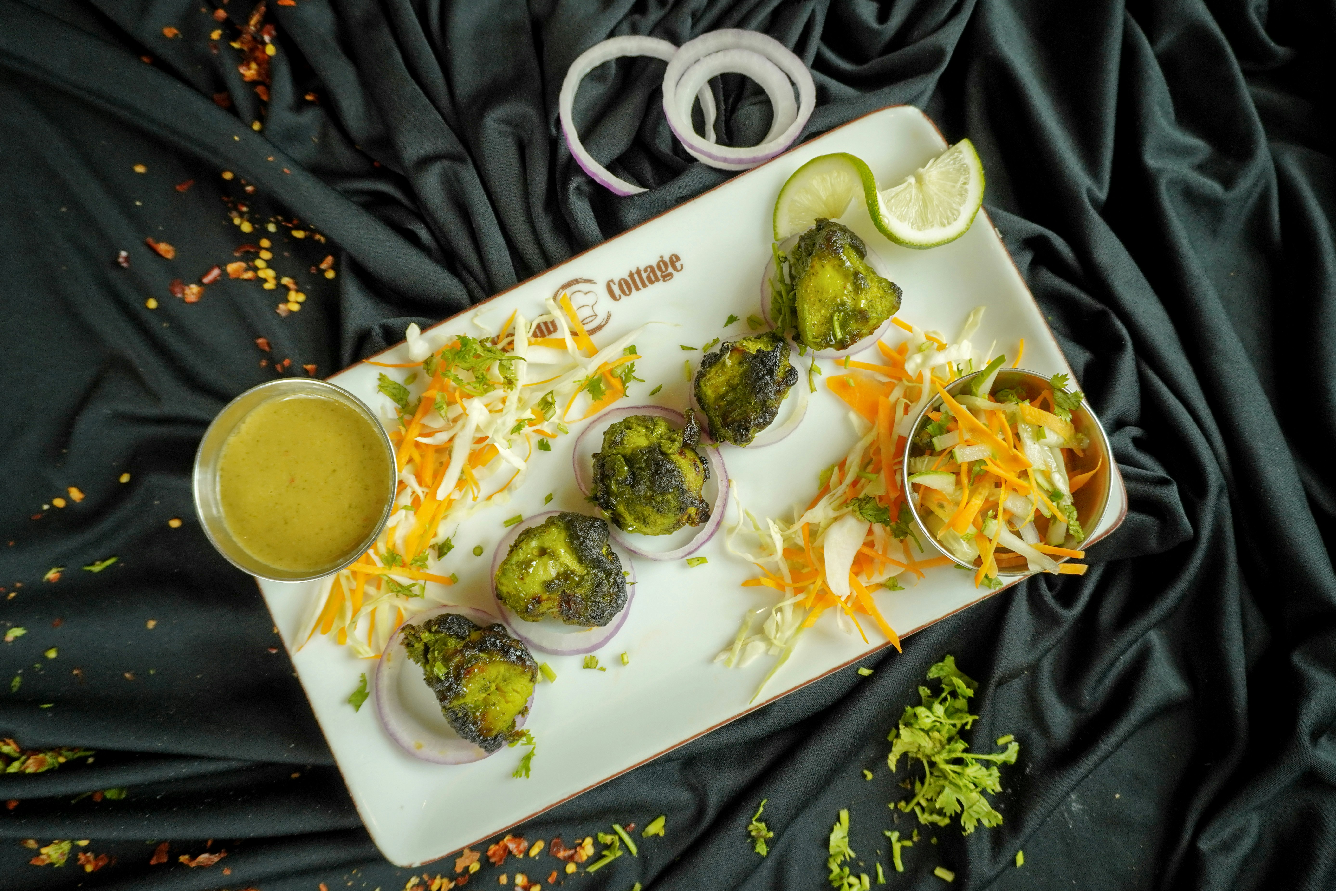 Green-gold Sushi Ring: A Top-Down Plate of Avocado-wrapped Delicacies