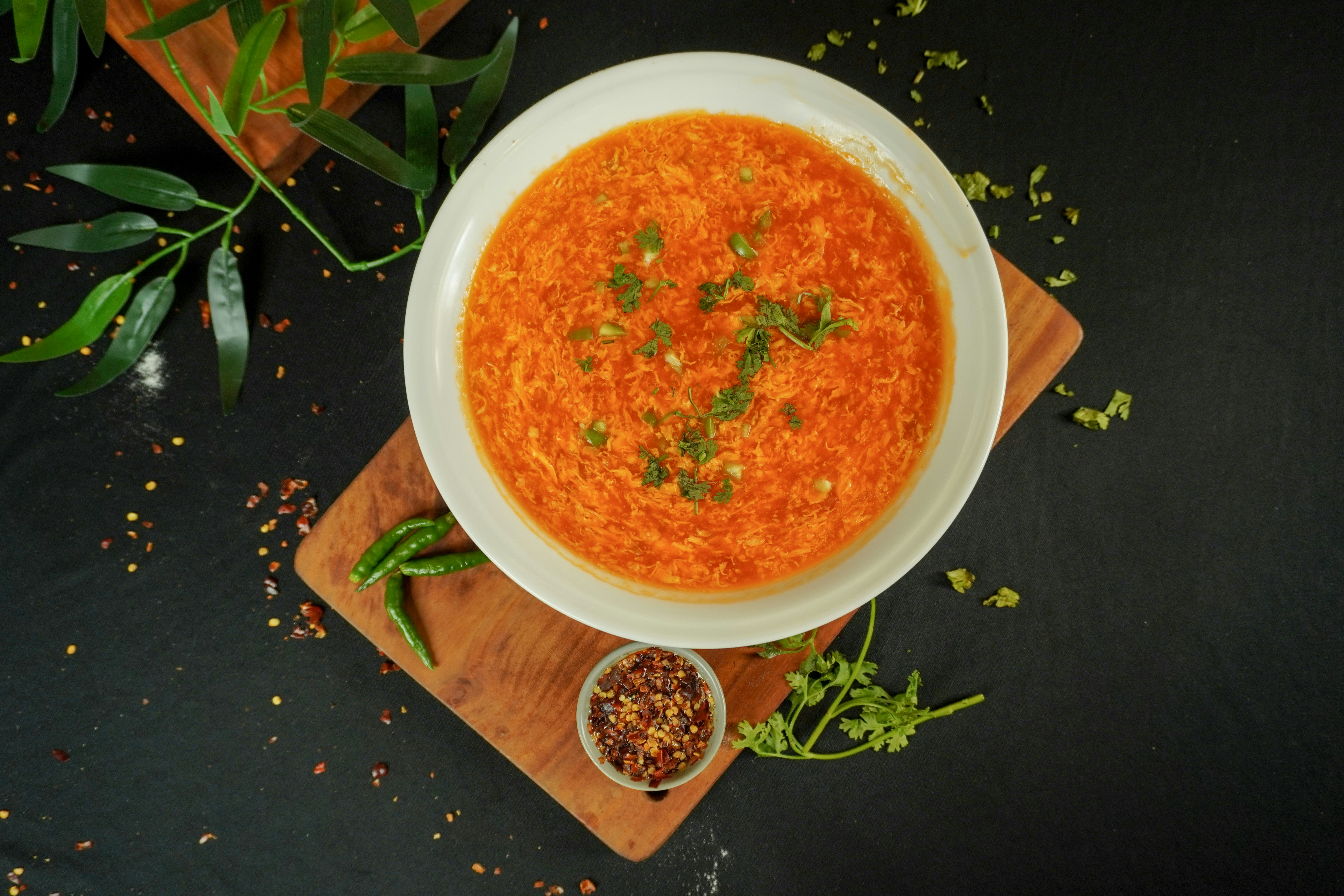 Bright Orange Soup on a Rustic Board