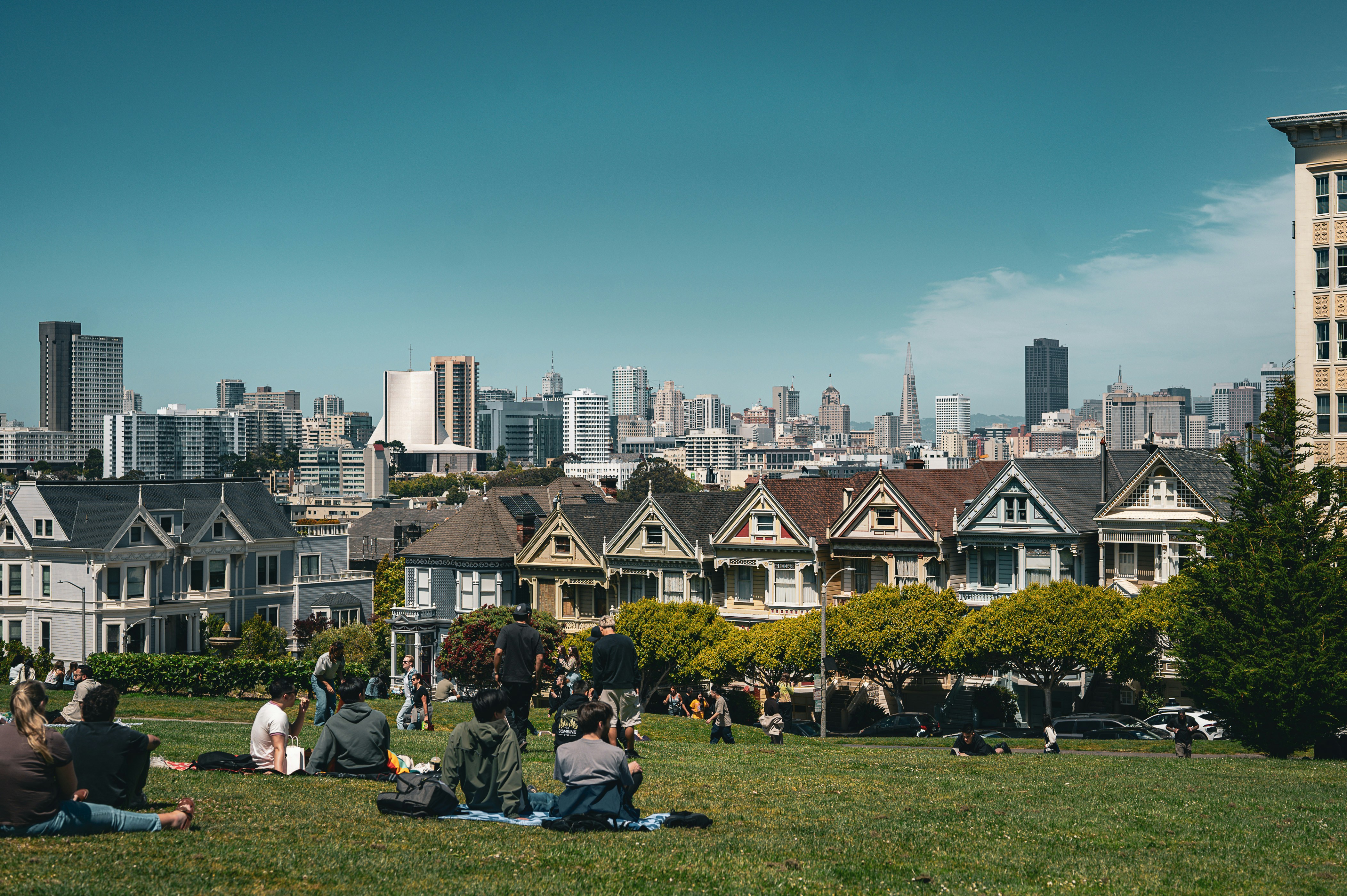 People at a leisure park with a city skyline backdrop