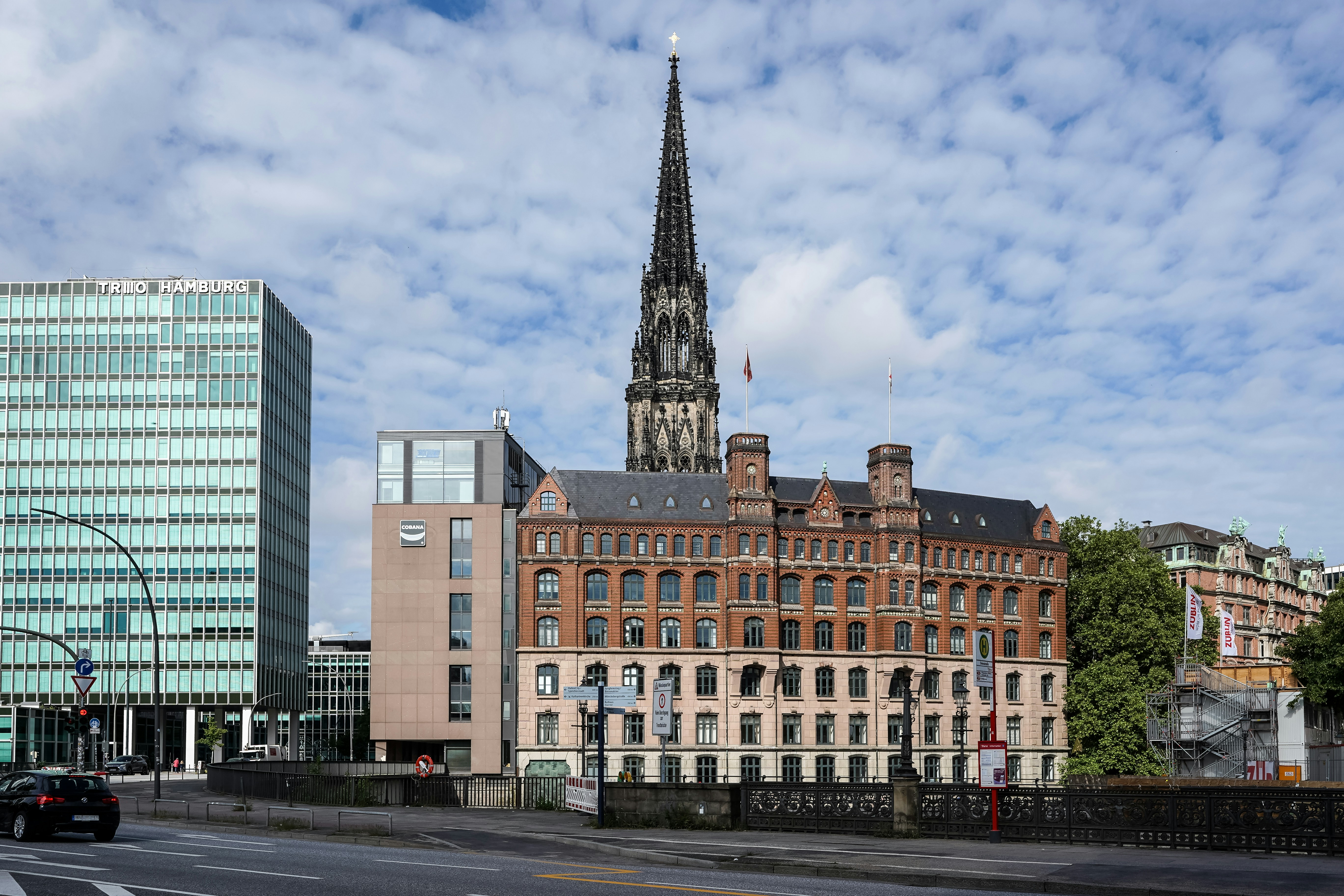 Gothic Spire Amid Modern Glass and Brick