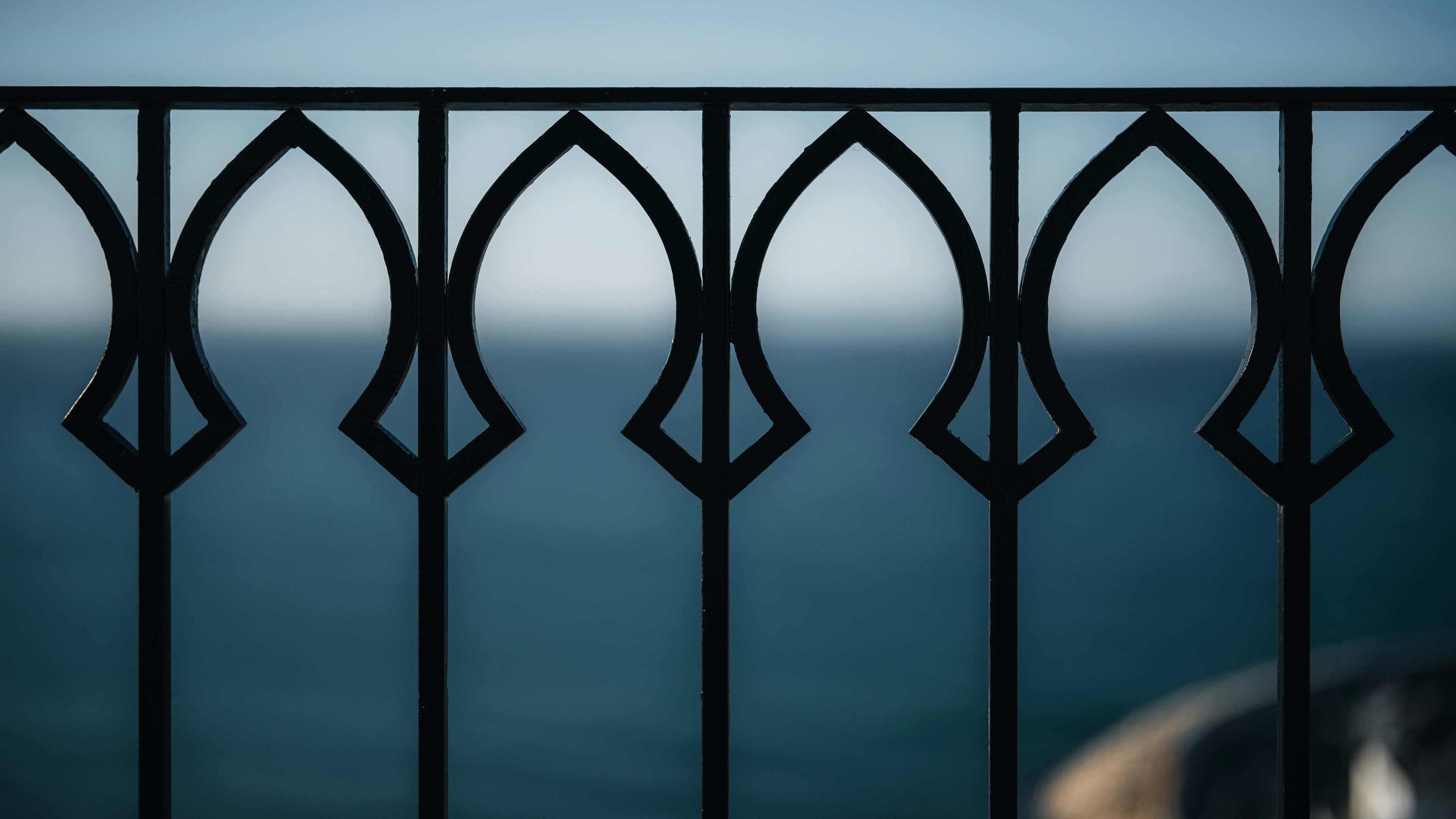 Ironwork Frieze Over the Sea: Refracted Geometry