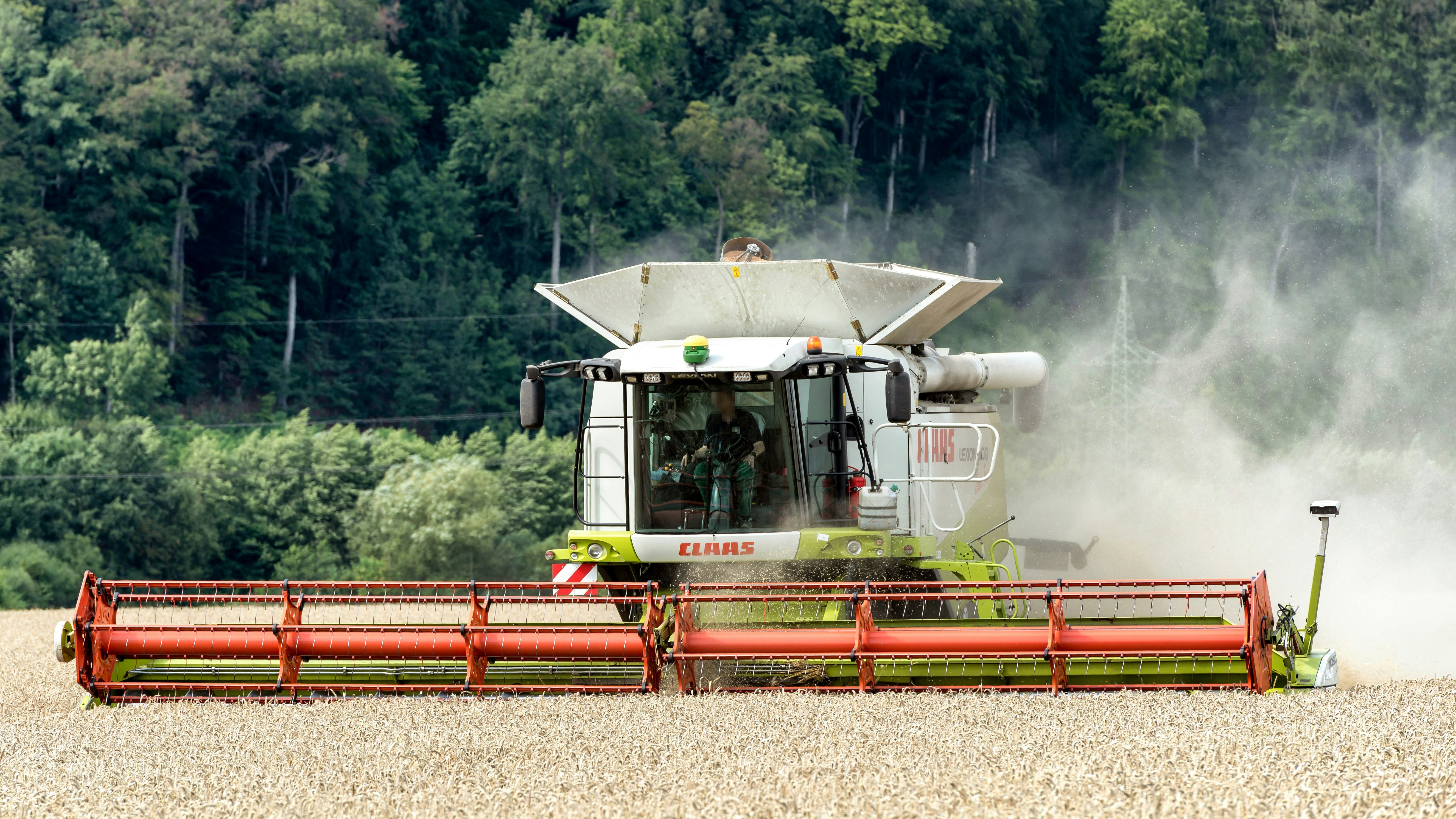 Dust and Harvest: The Red-Bordered Combine in Action
