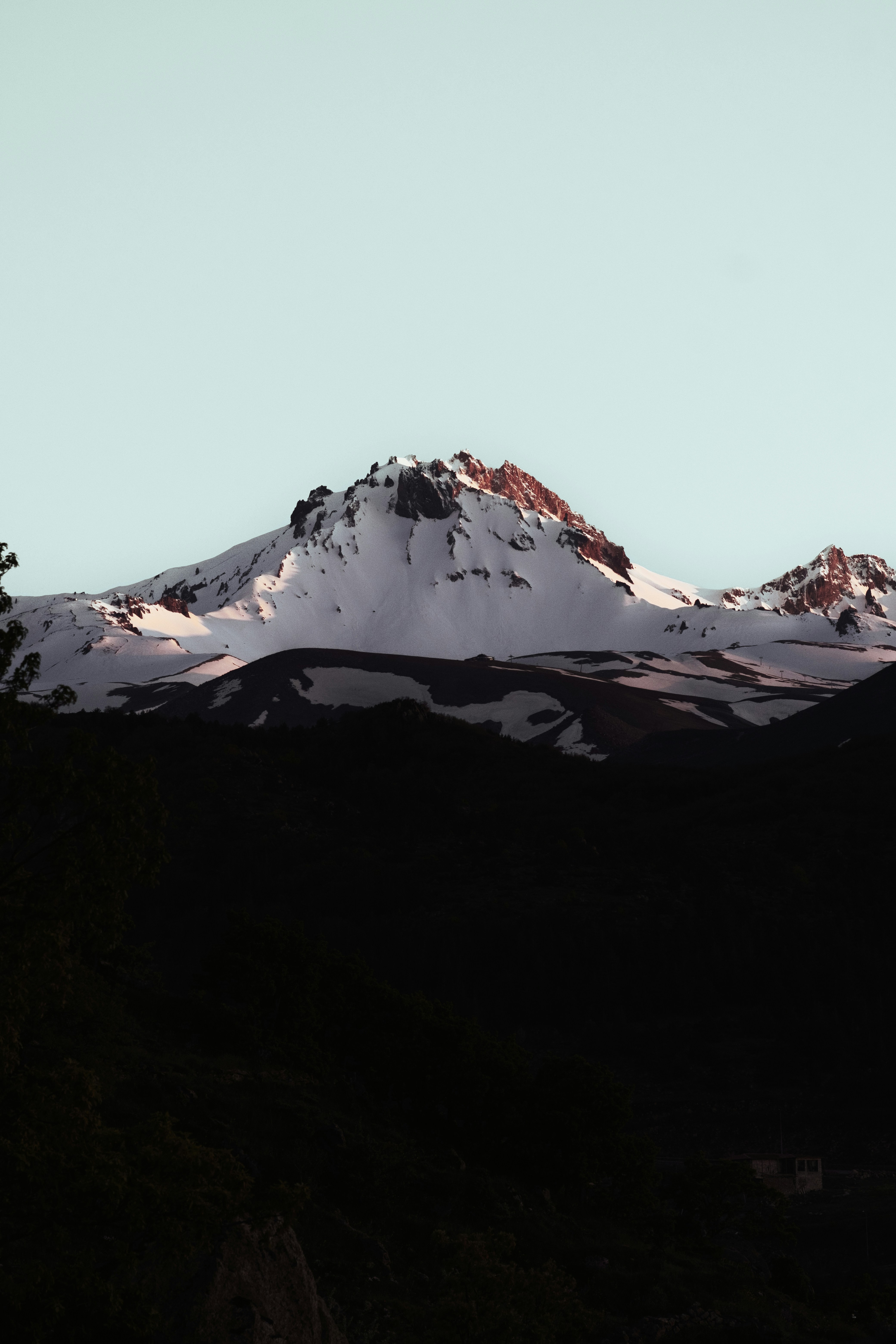 Snow-crowned Ridge Under a Pale Sky