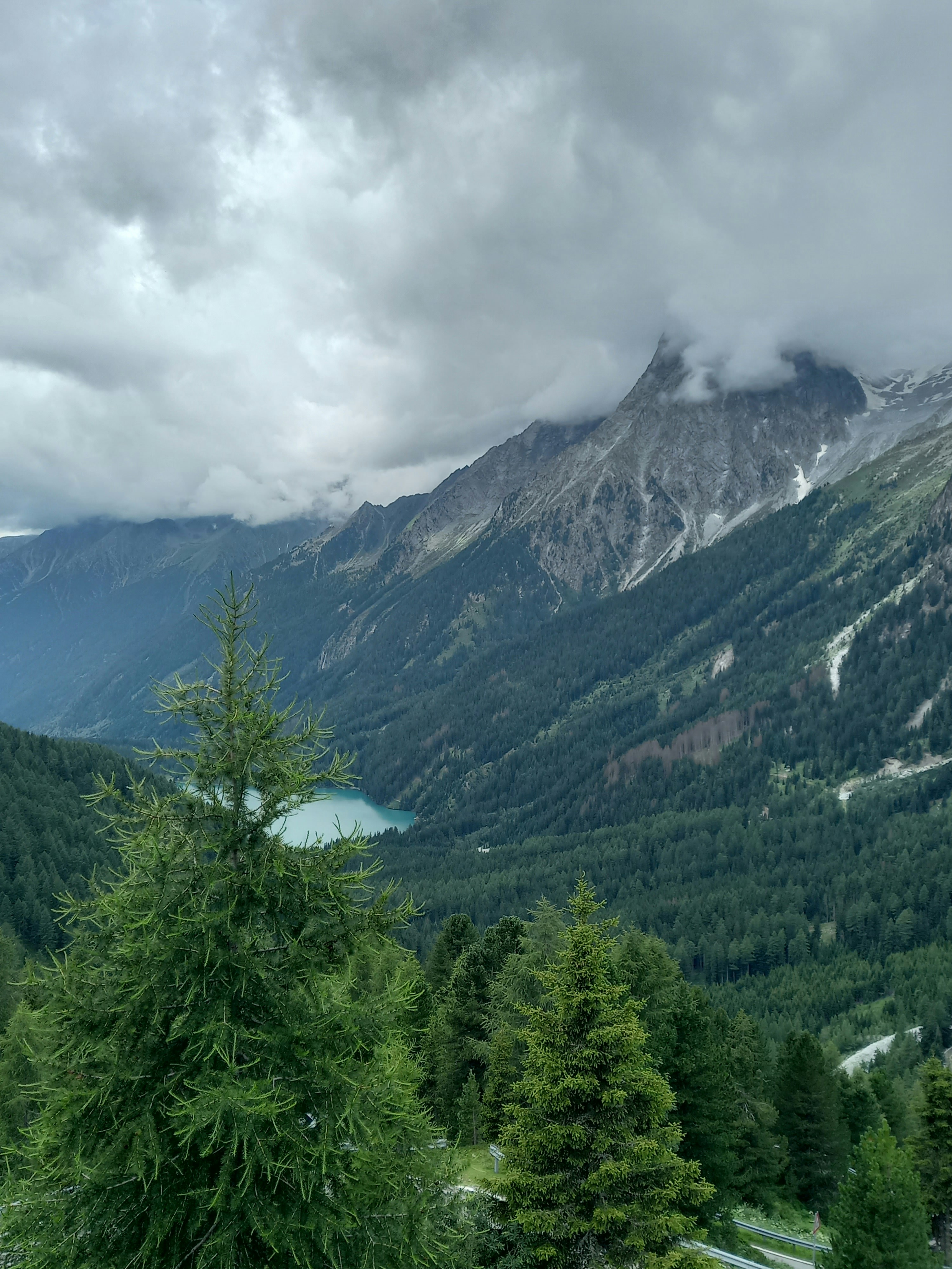 Mist-Sheathed Peaks Over a Quiet Alpine Lake