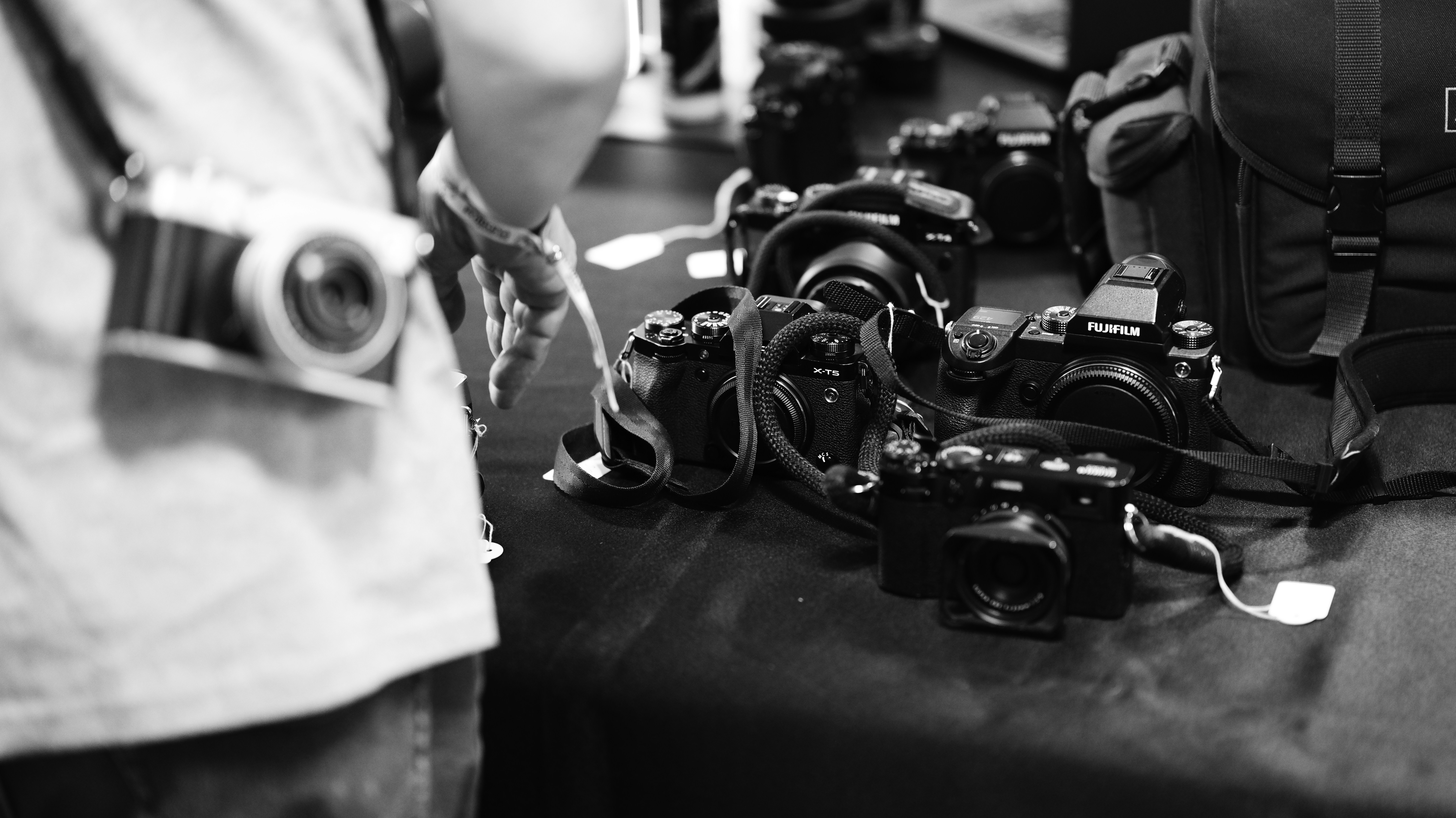 Mirrorless Meetup: a sea of vintage and modern gear laid out on a velvet-black table