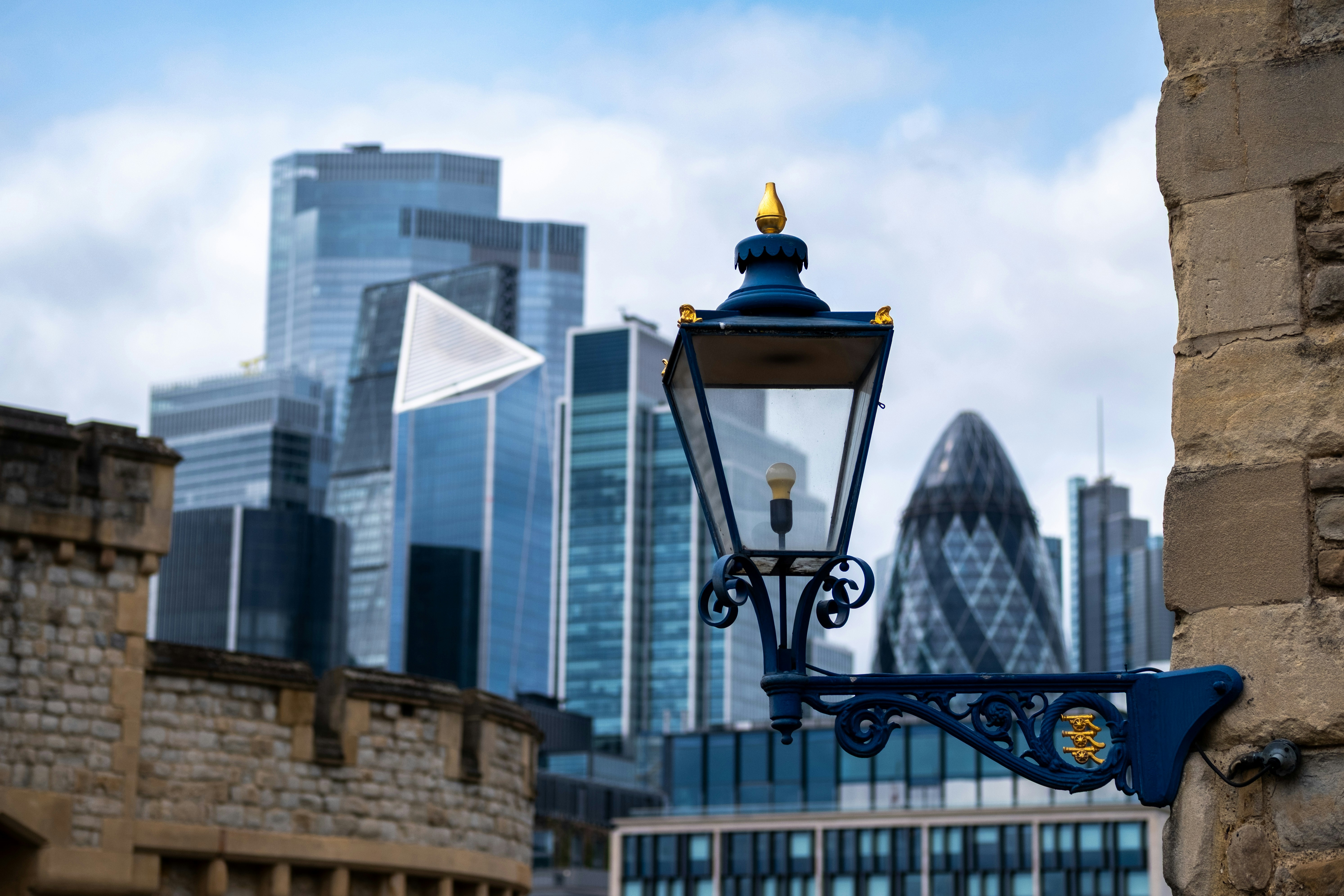 Urban Lantern: A Classic Lamp Post Framing Modern Skyscrapers