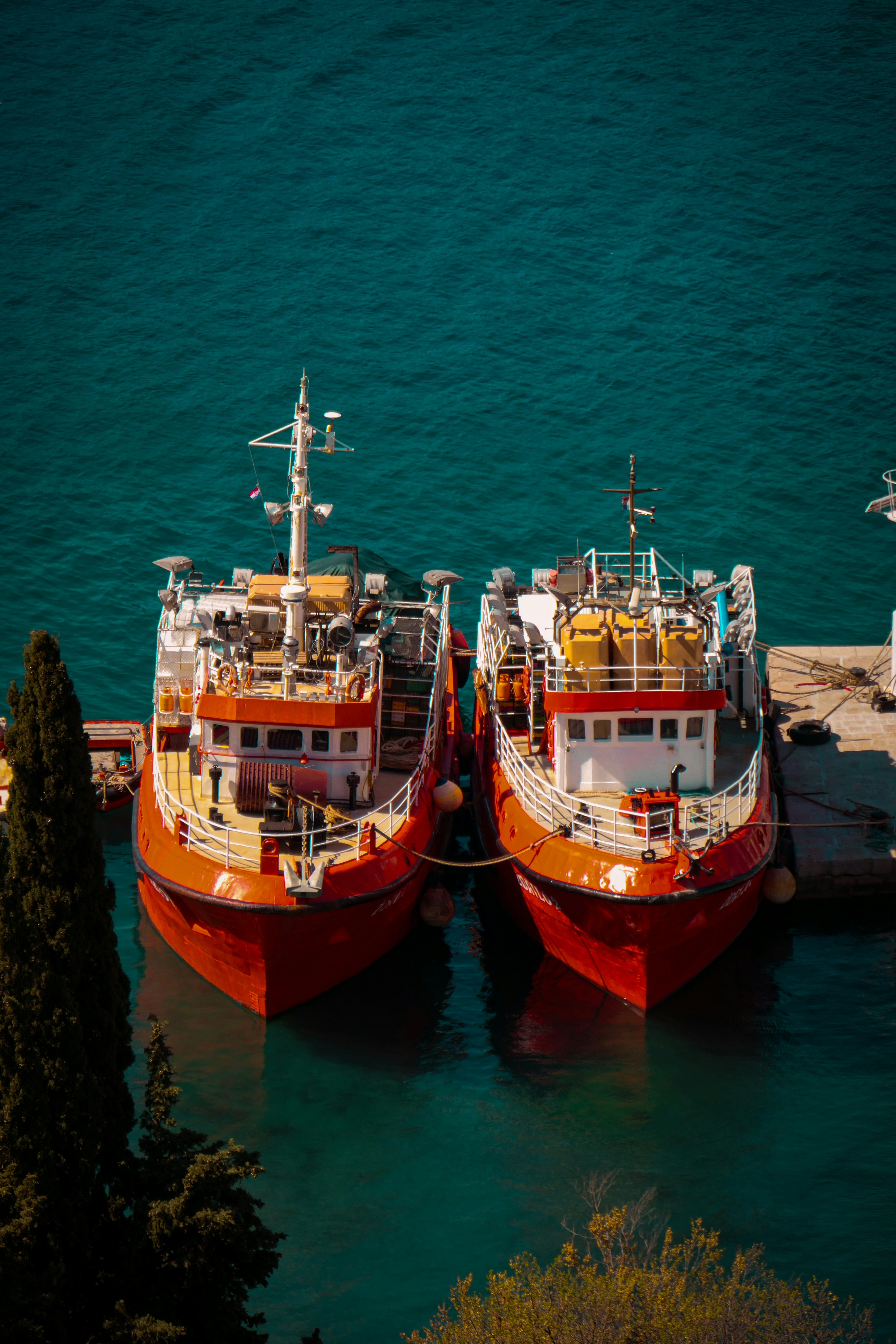 Two Red Tugs at Dusk: Quiet Power by the Pier