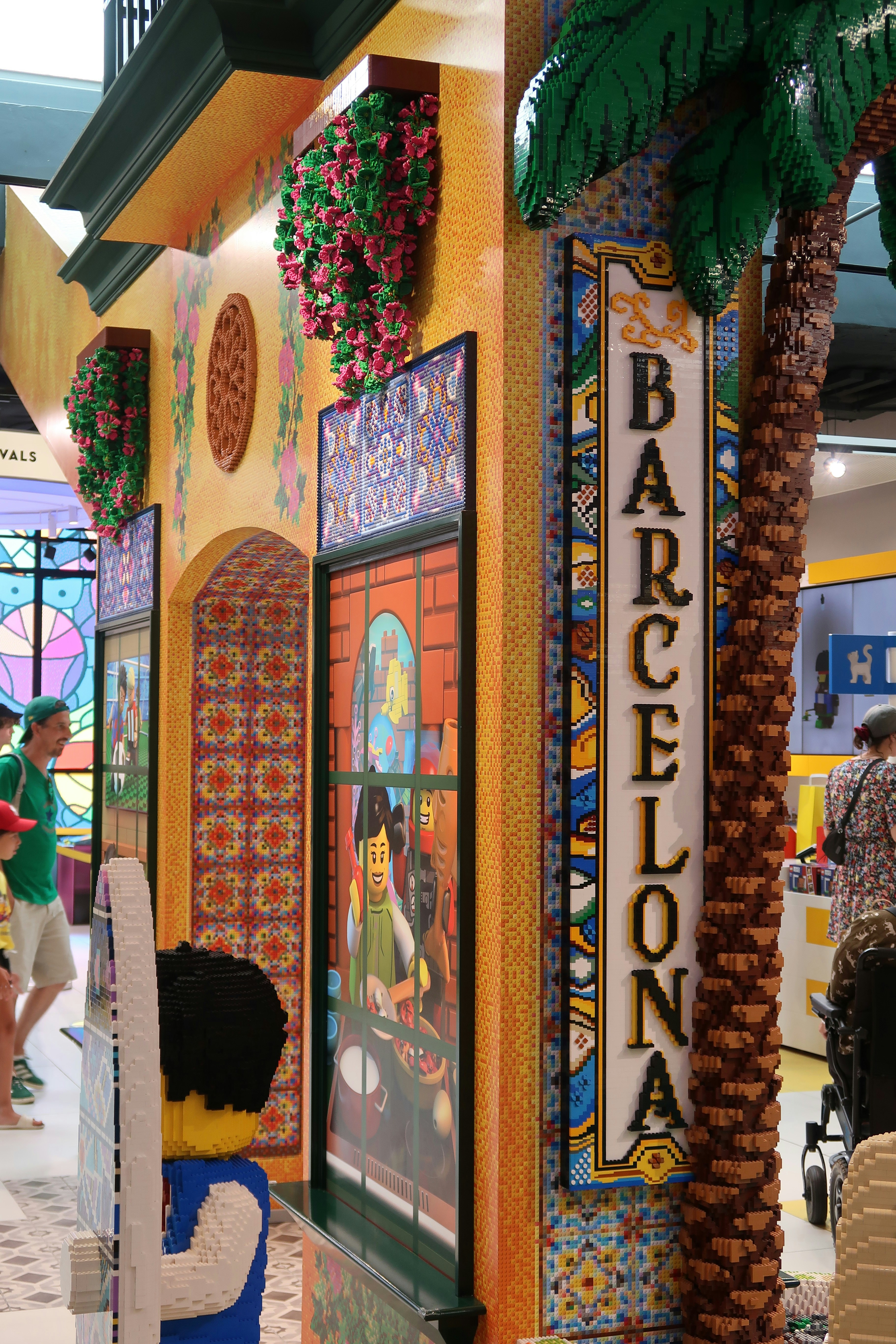Colorful Barcelona Sign Cast in LEGO Mosaic Surroundings