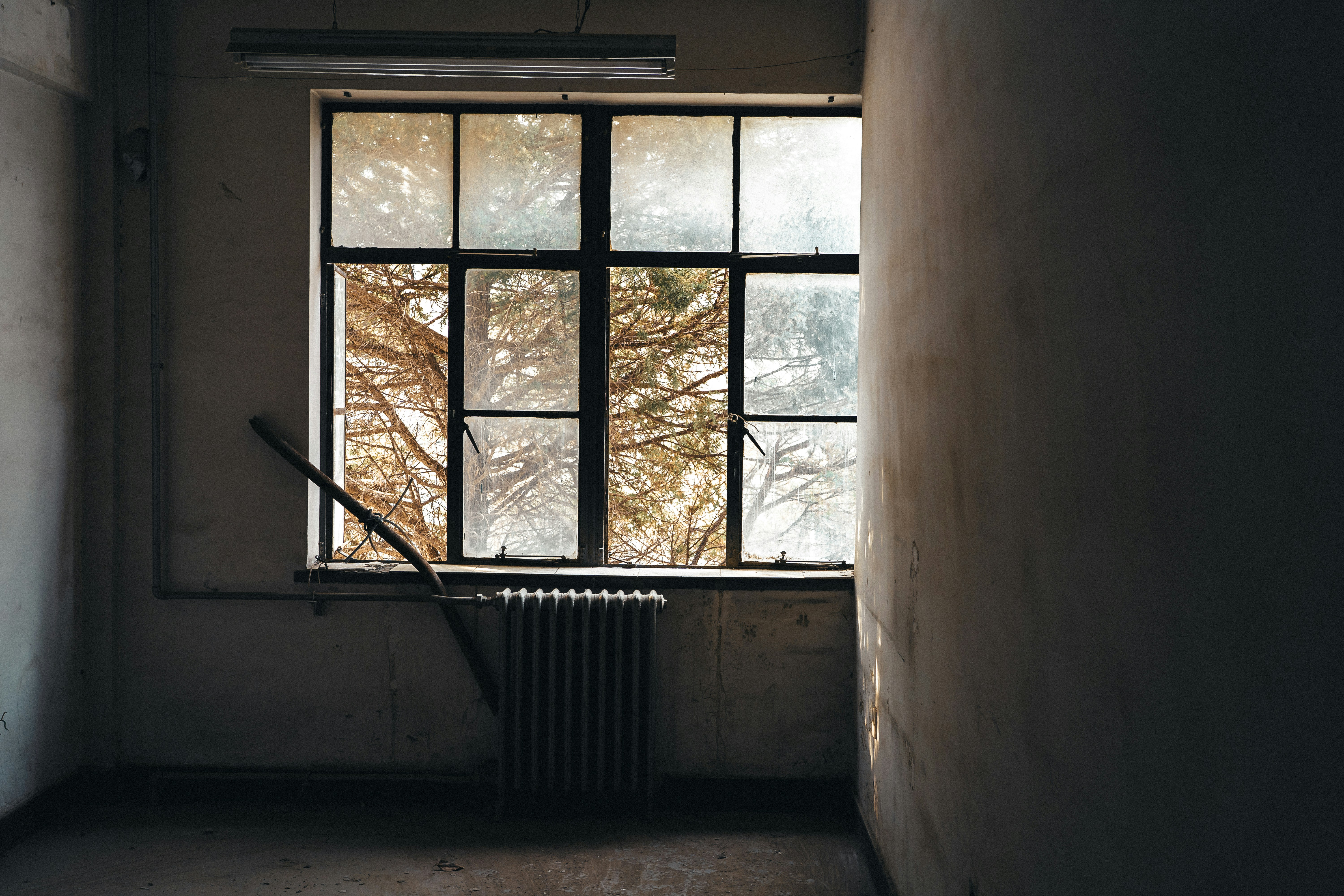 Moonlit Window Grid: Abandoned Light in an Industrial Room