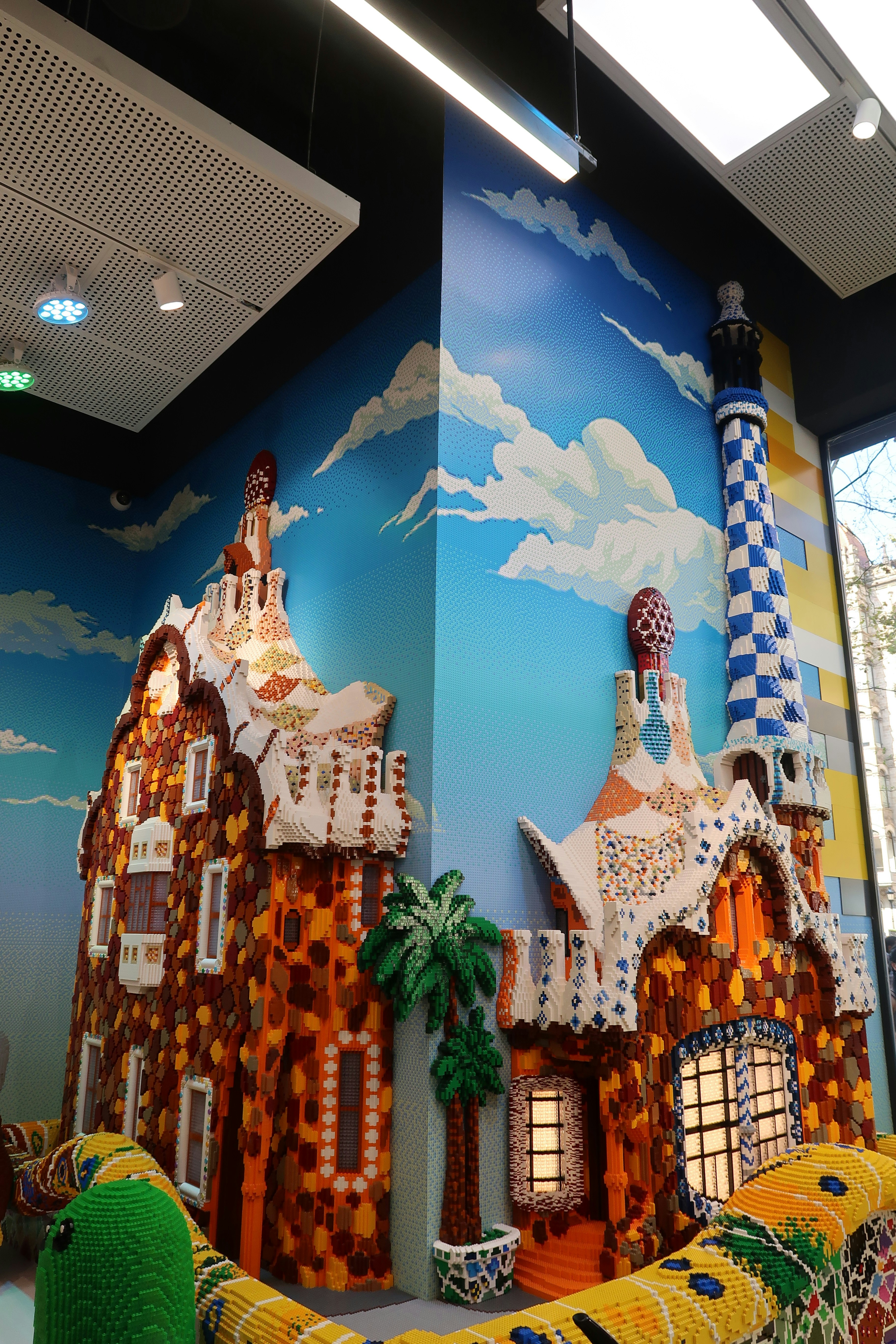 Whimsical Mosaic Facades Rising Against a Sky of Tiles