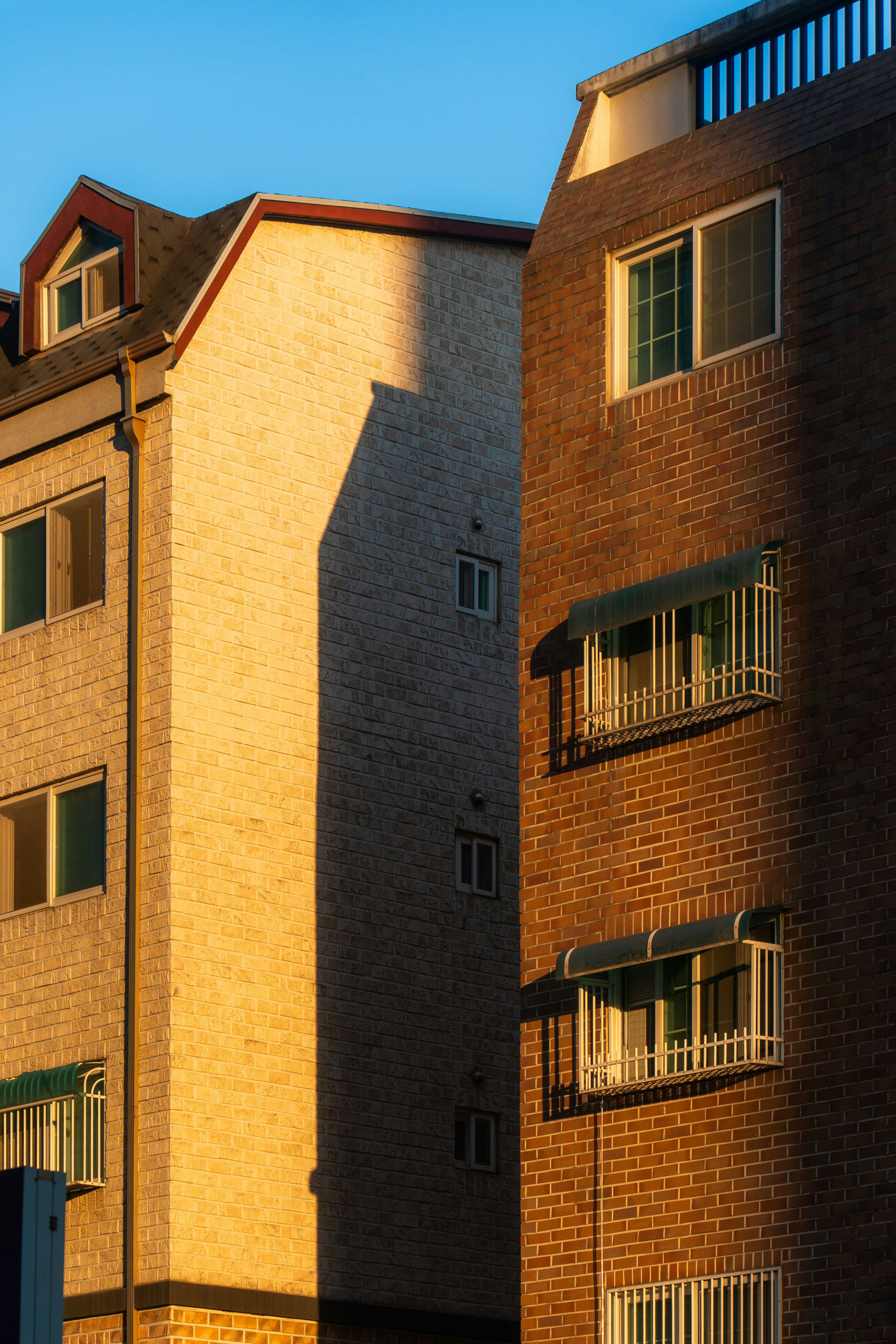 Golden Hour Between Brick Towers
