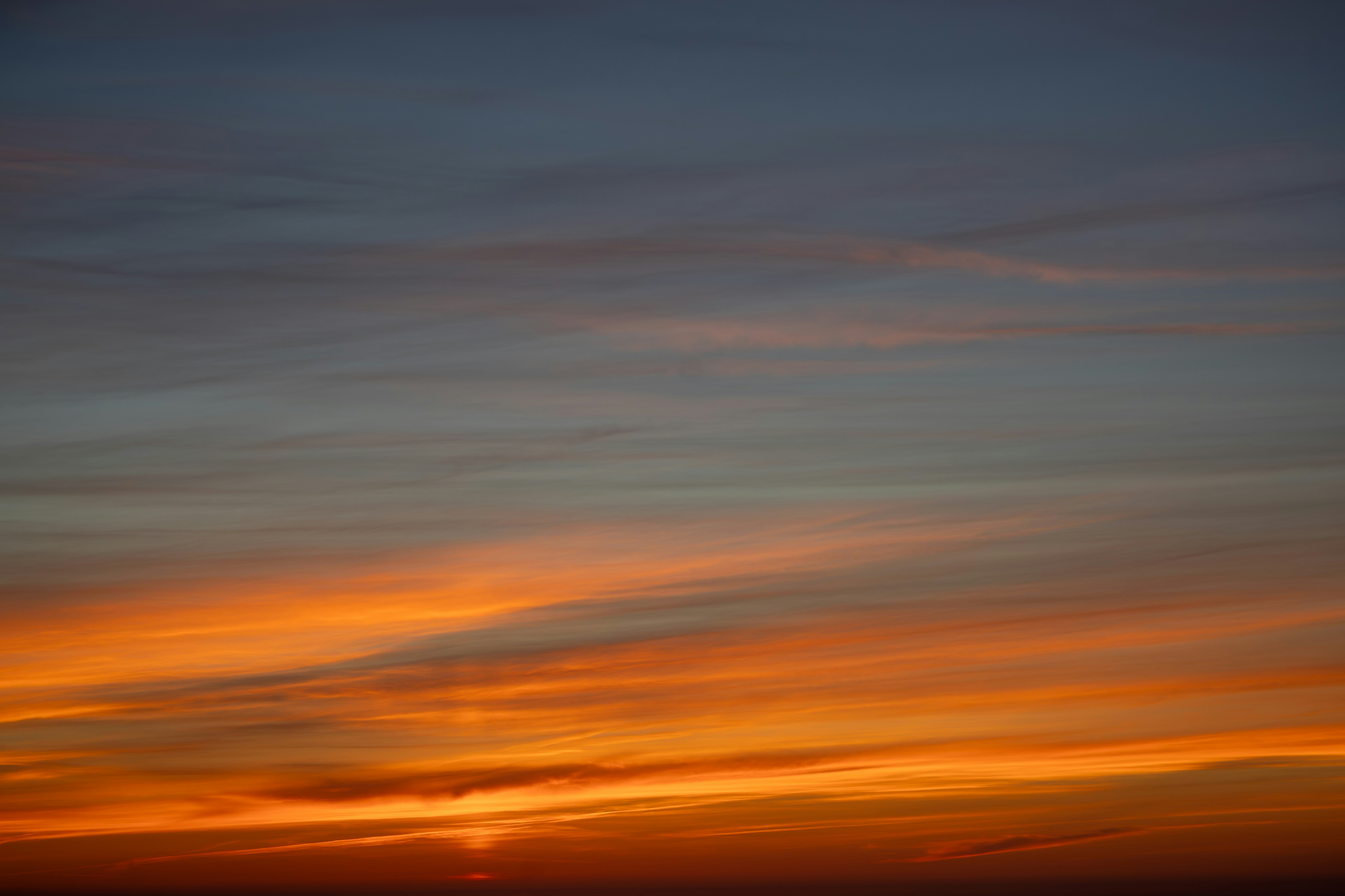 Embers on the Horizon: Quiet Sunset Over Awake Skies