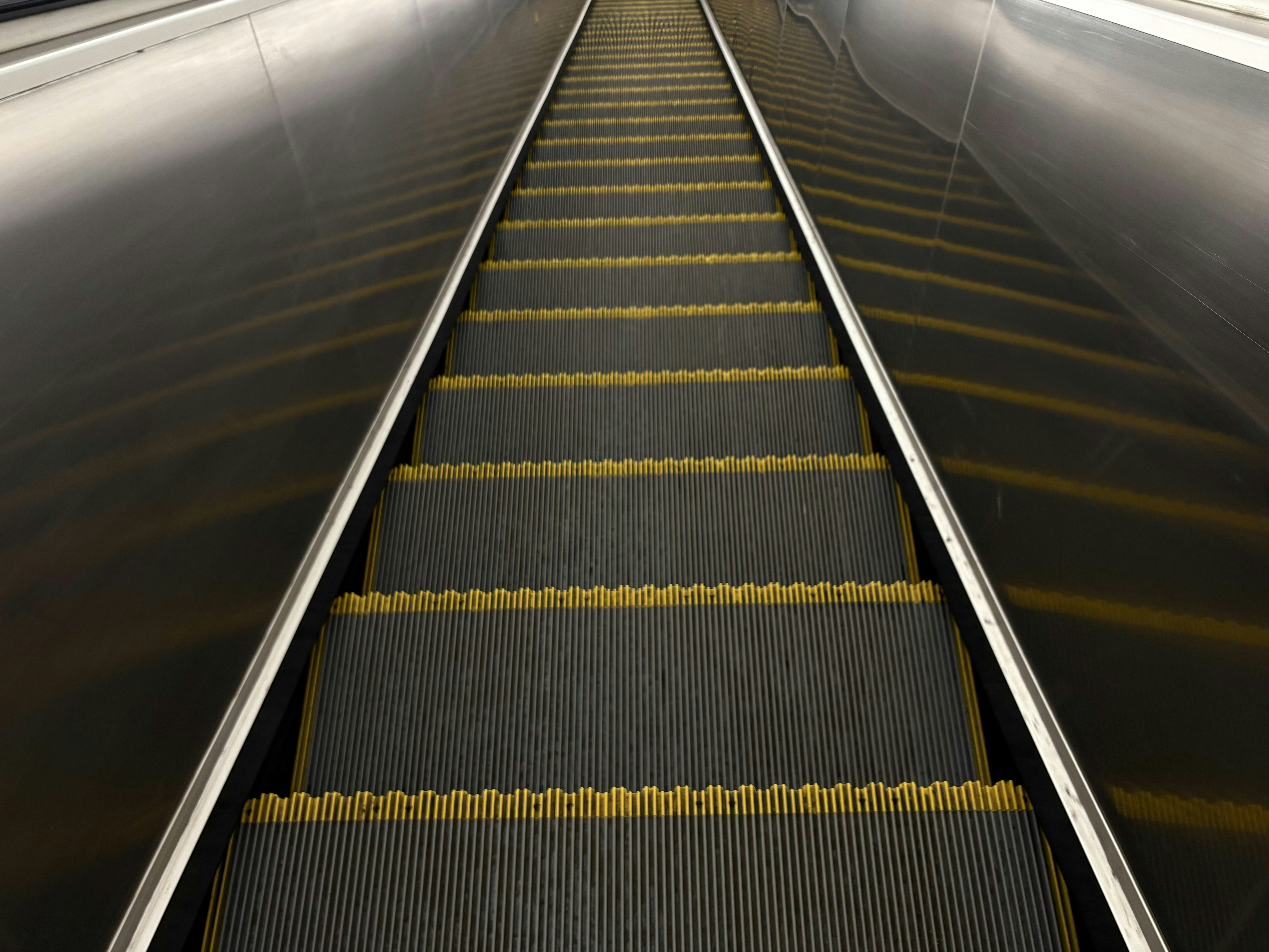 Midway Descent: A Symmetrical Walk Down the Escalator