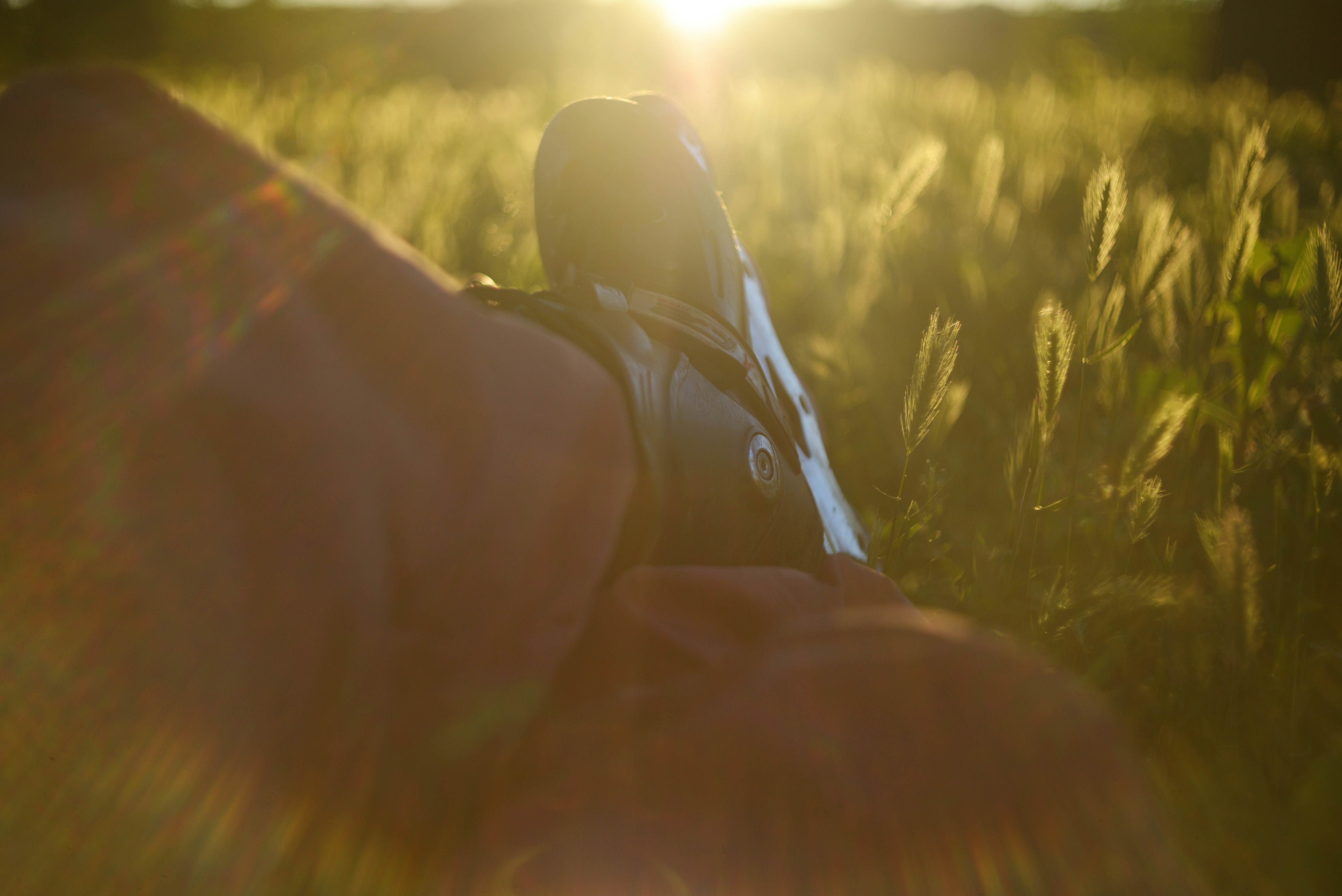 Boots and Grass at Sunlit Dusk