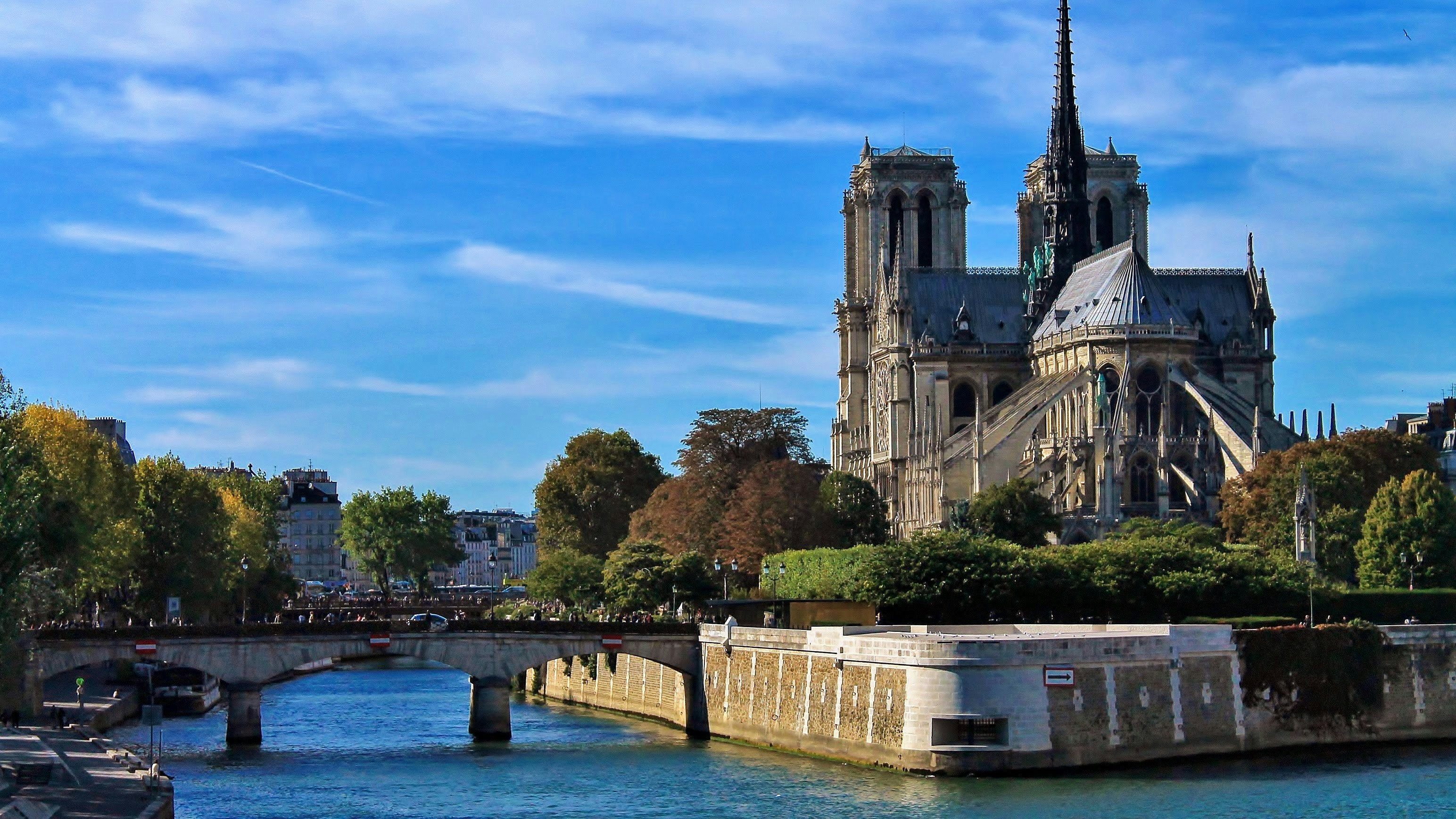 Notre-Dame Over the Seine: Towers Reaching Toward a Clear Autumn Sky
