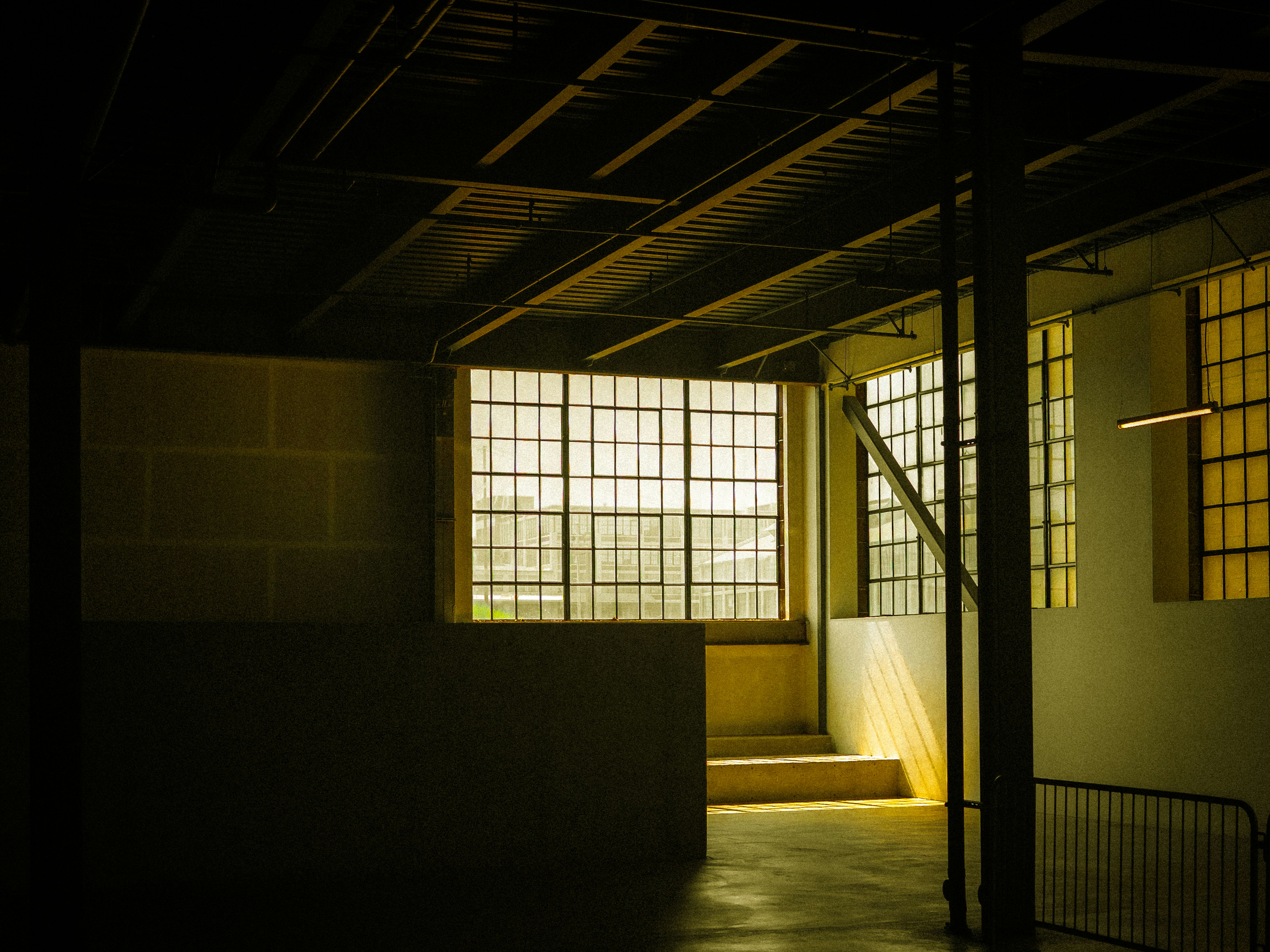 Muted Light, Industrial Quiet: Sunlit Steps in a Warehouse