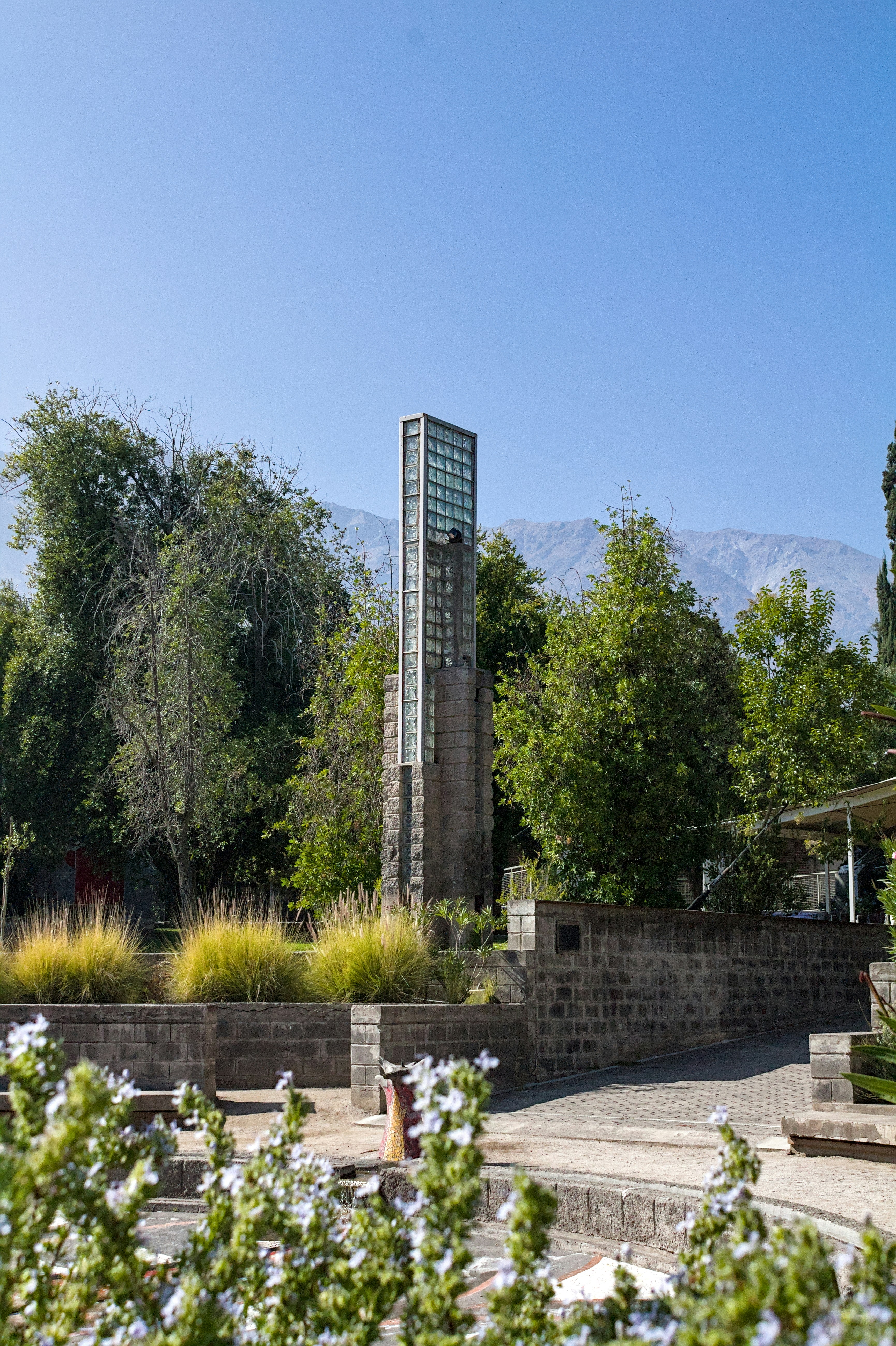 Stone pillar and parkway under a clear blue sky