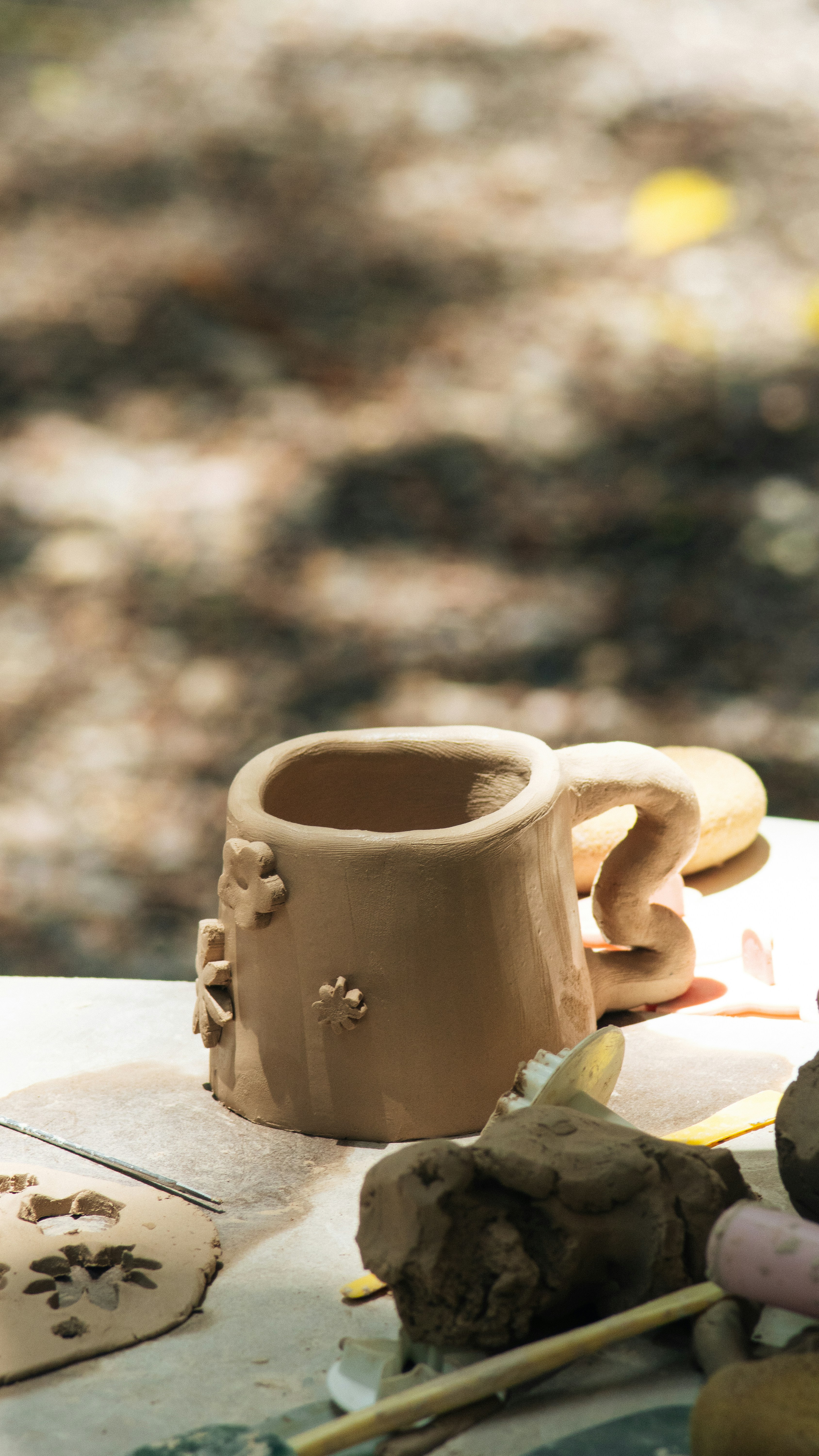Clay Vessel in Soft Studio-like Light on a Pottery Table