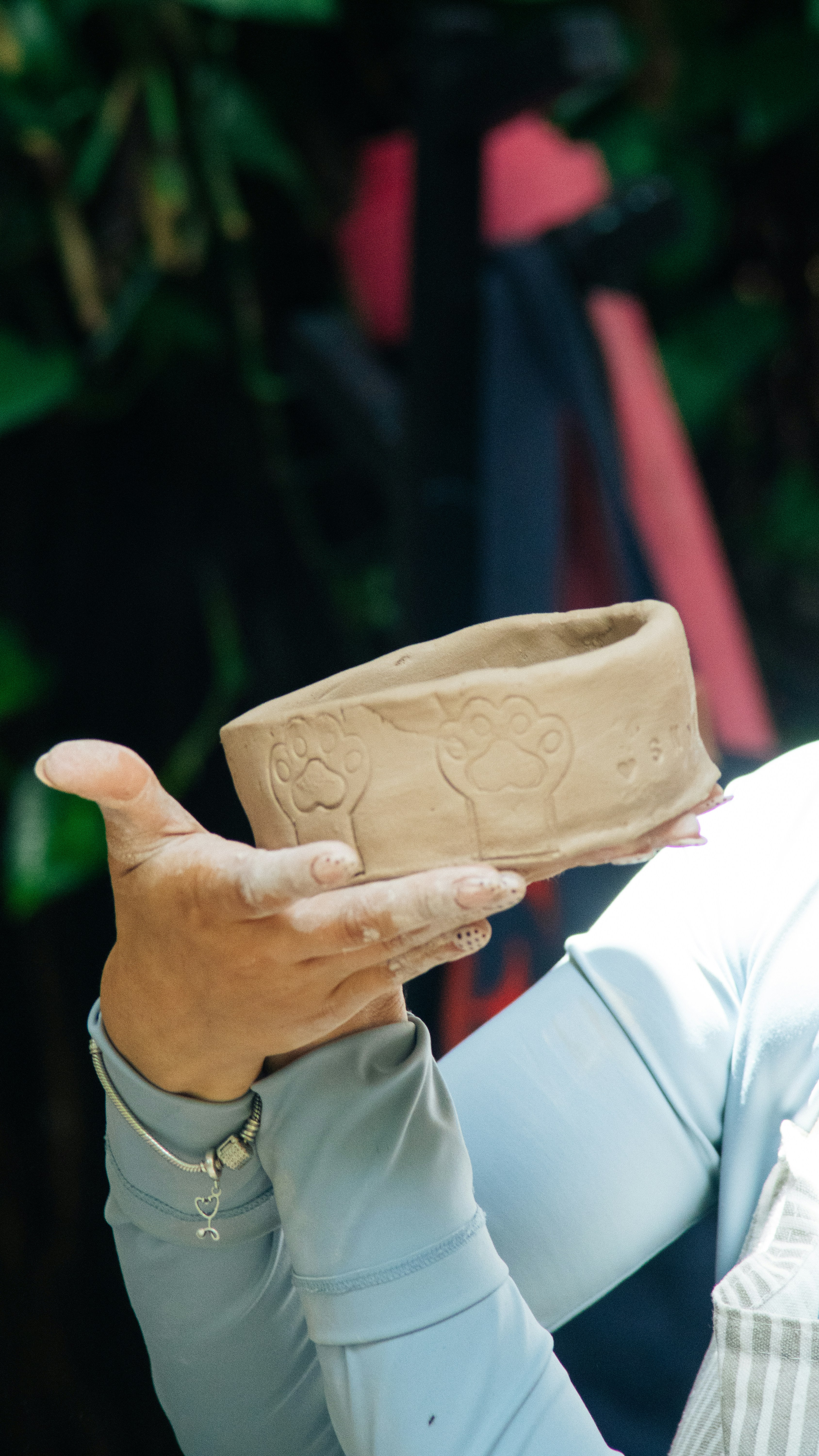 Clay Studio Moment: Hand, Pot, and Craft in Focus