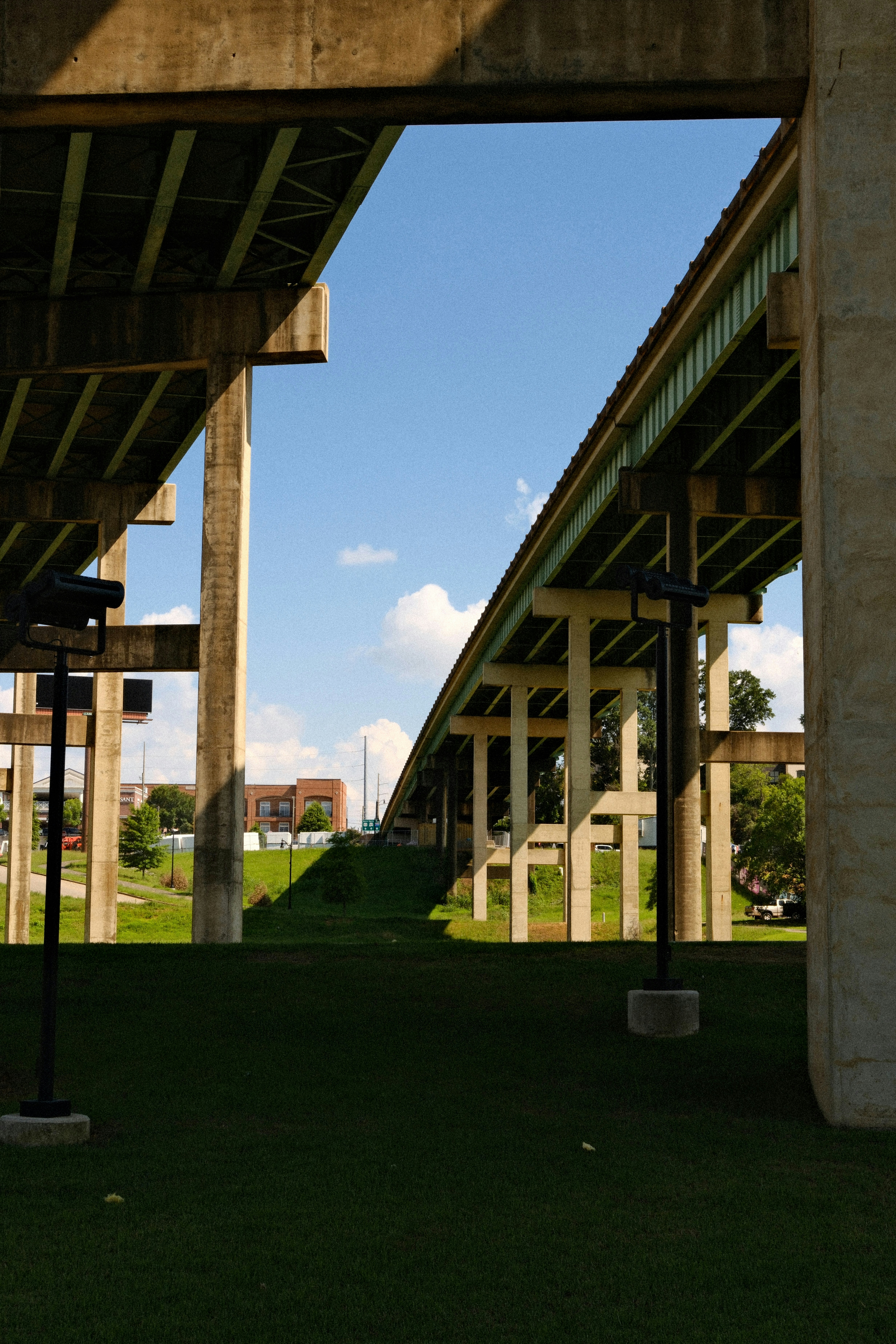 Underpass Between Concrete Beams: A Corridor of Sky and Structure