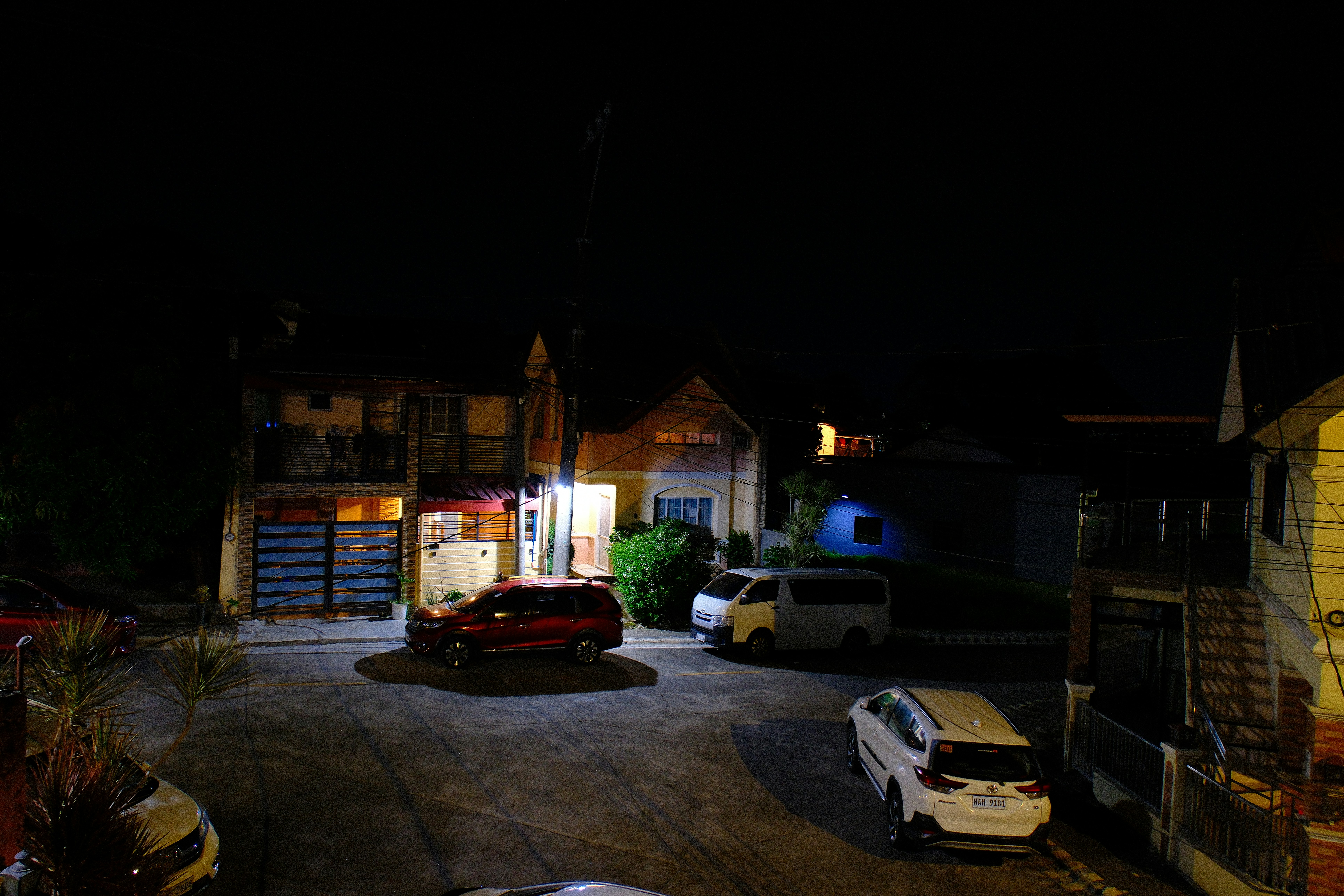 Night Courtyard in Quiet Neighorhood Under Street Lanterns