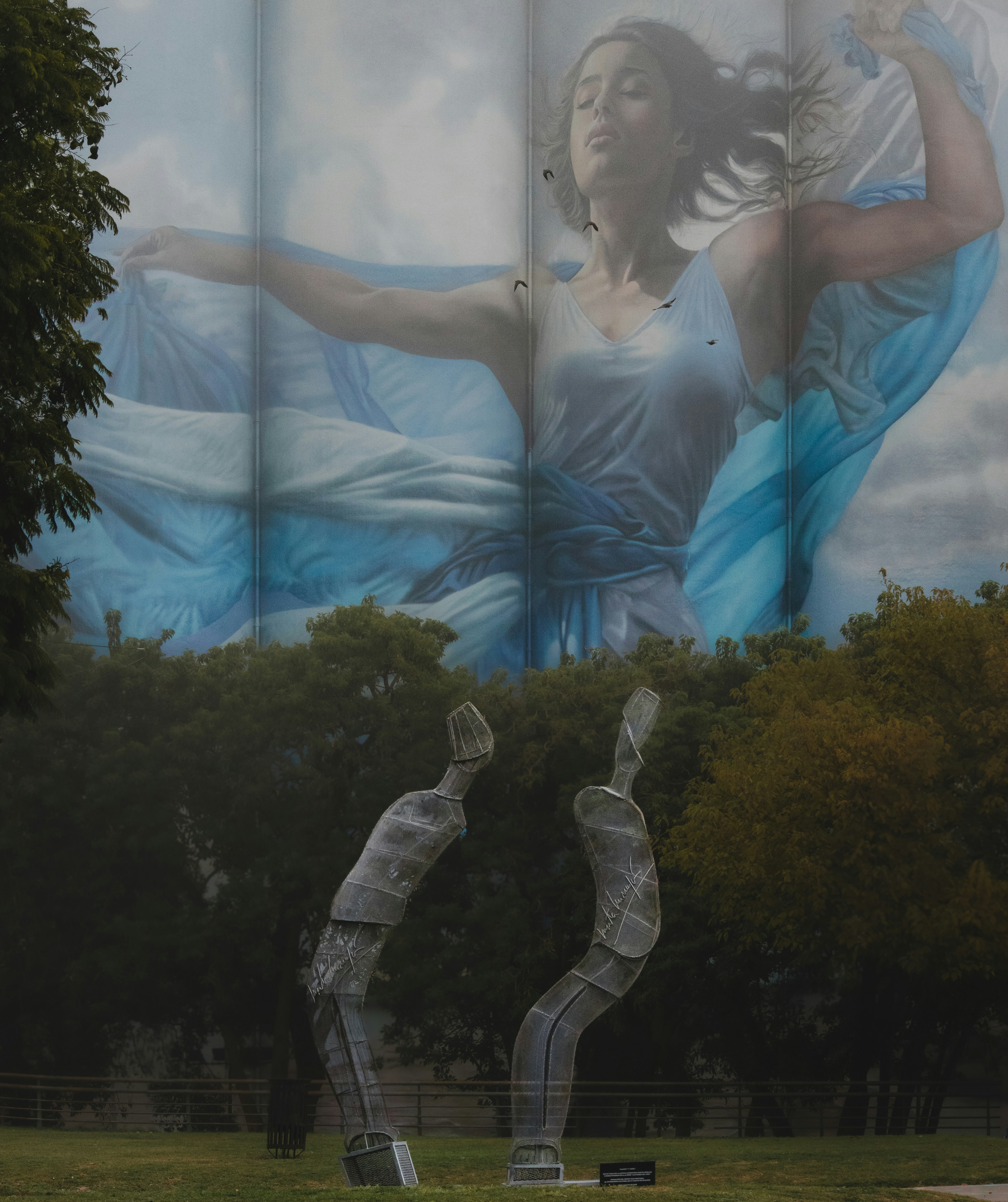 Floating Arcs of Steel: A Mural and Sculptural Echoes
