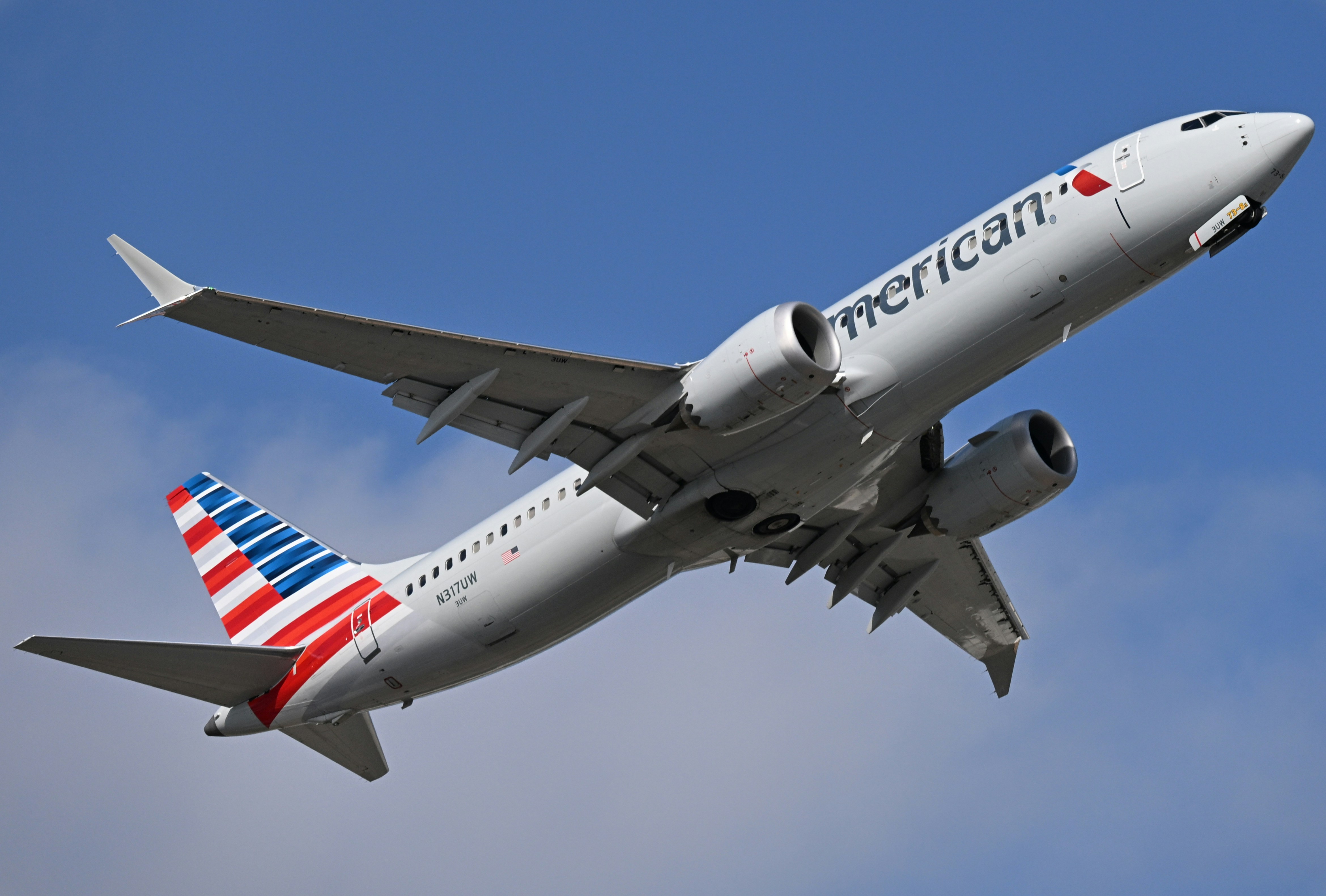 Skyward Horizon: American Airlines A321 Ascending Against a Clear Sky
