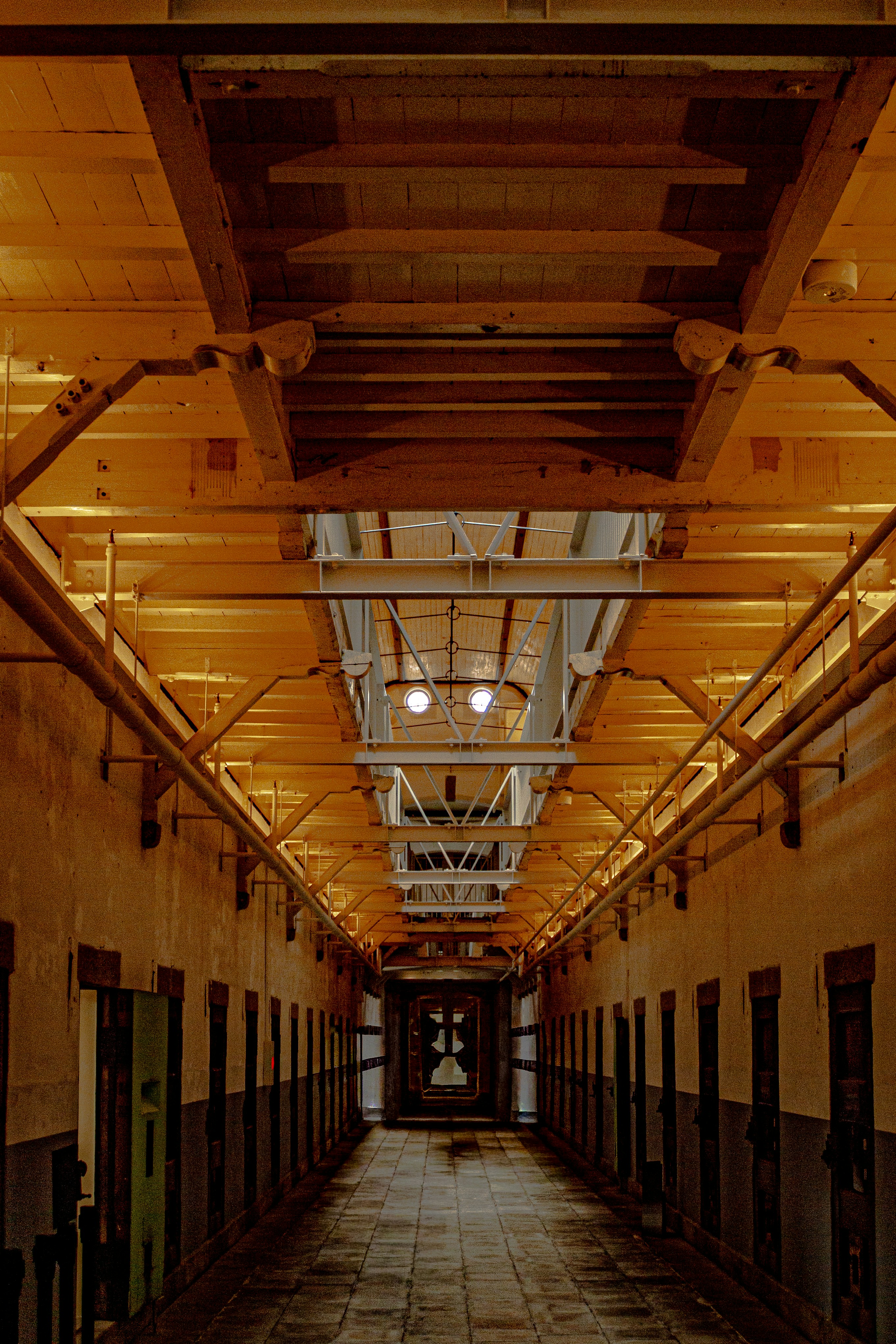 Echoes of a Long Corridor: Dim Warmth in an Abandoned Corridor