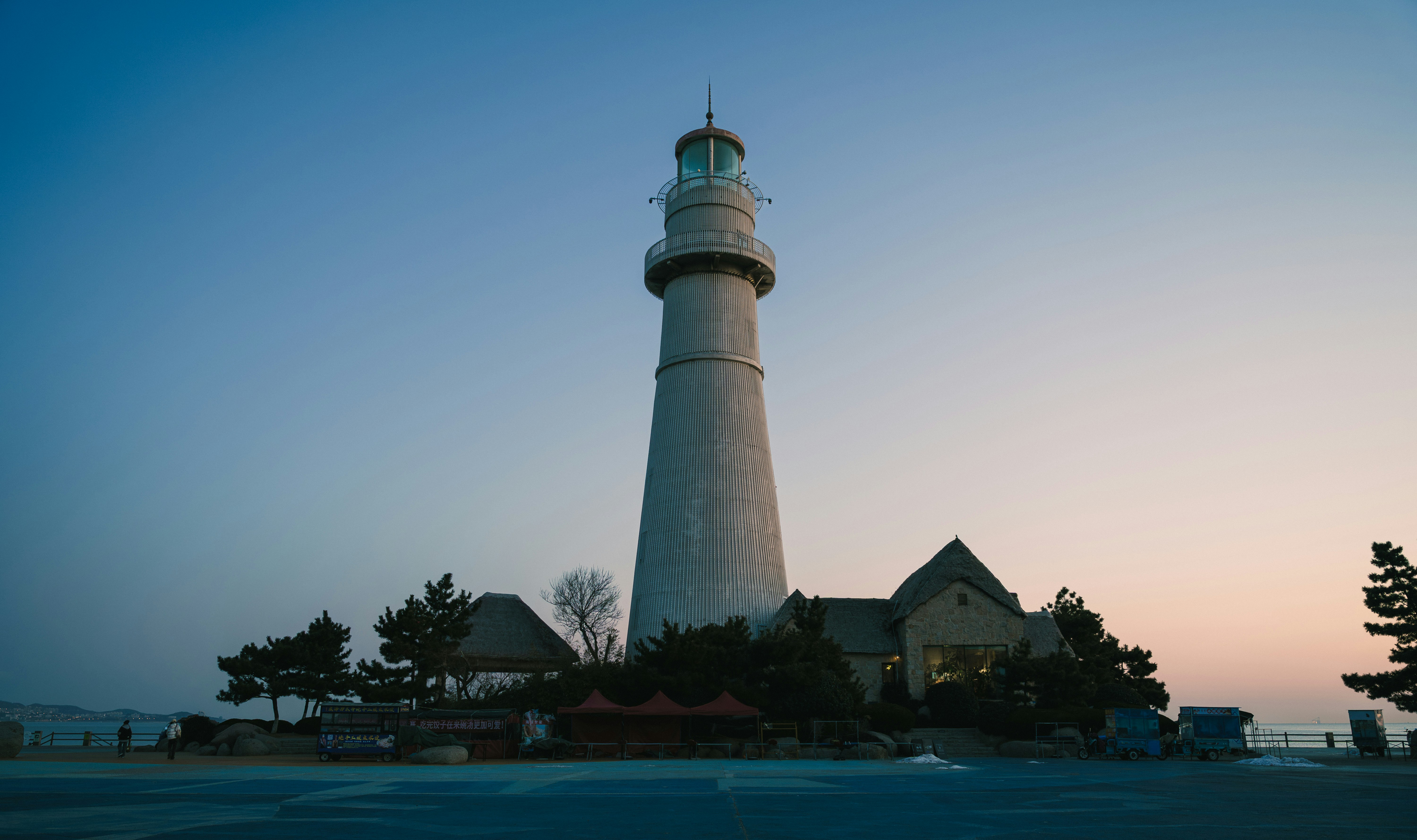 Beacon at Dusk: The Sea Lighthouse Standing Against the Quiet Horizon