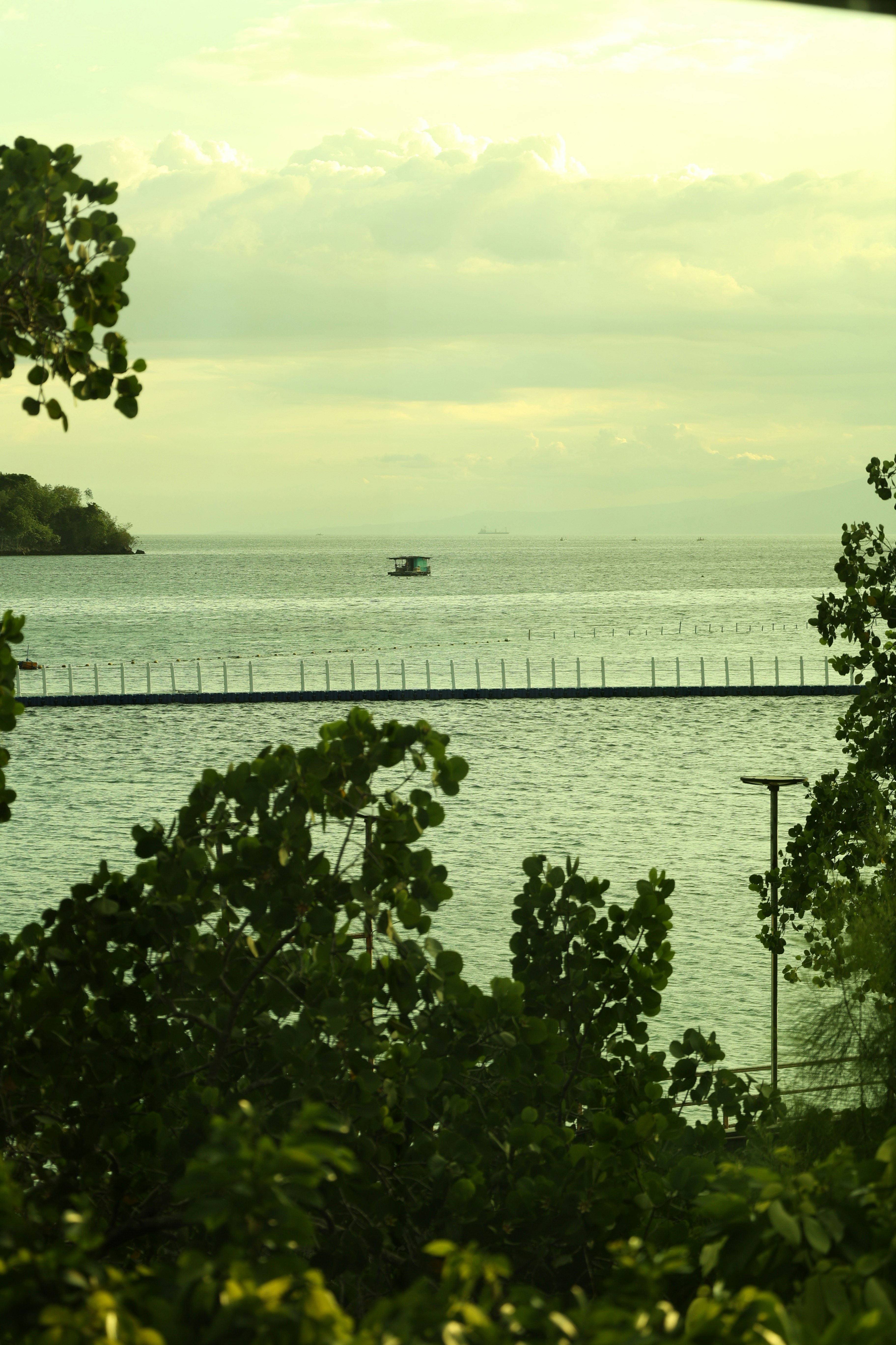 Quiet Horizon: A Lone Boat Across the Calm Sea