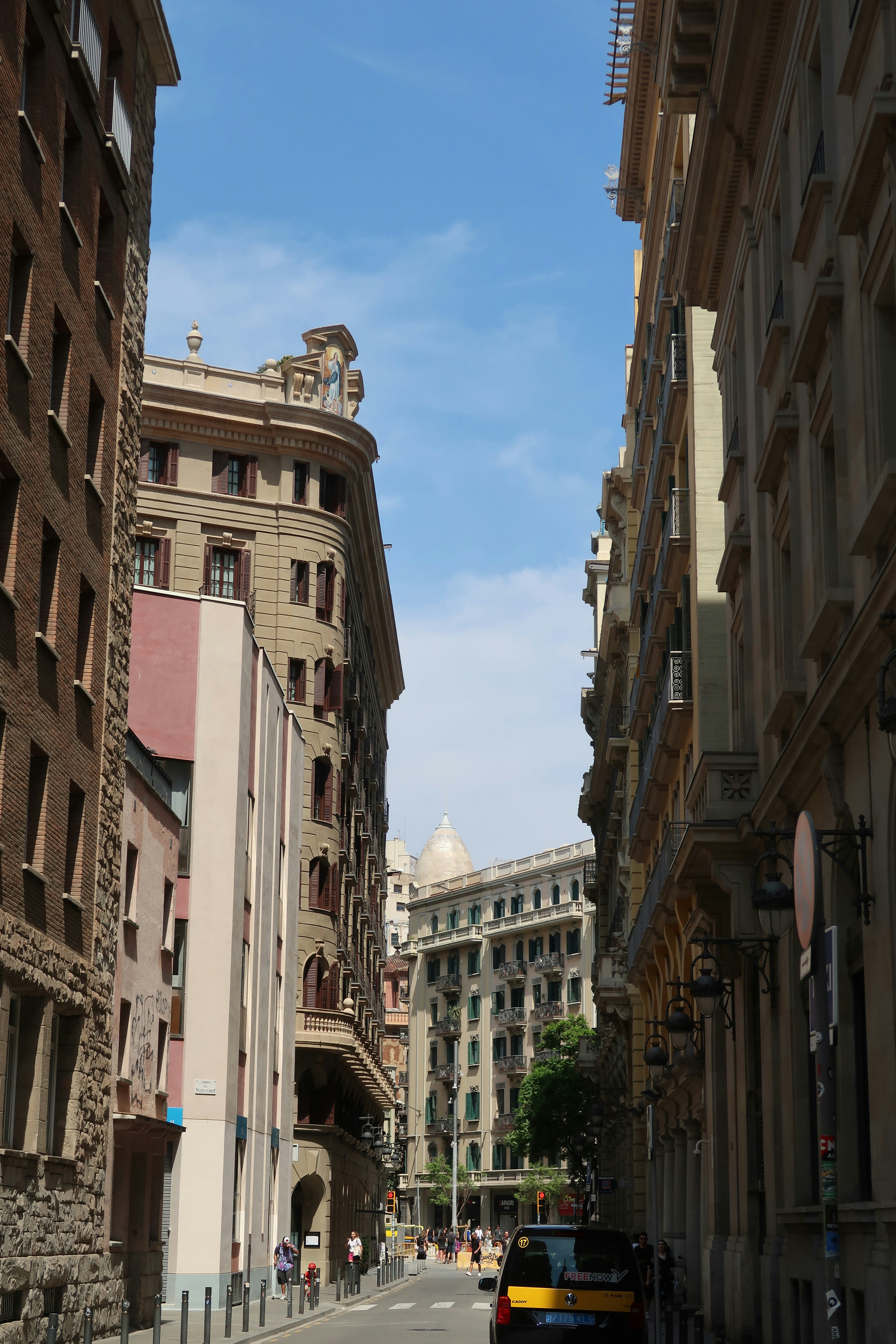 City Street Convergence: A Narrow Canyon of Architecture