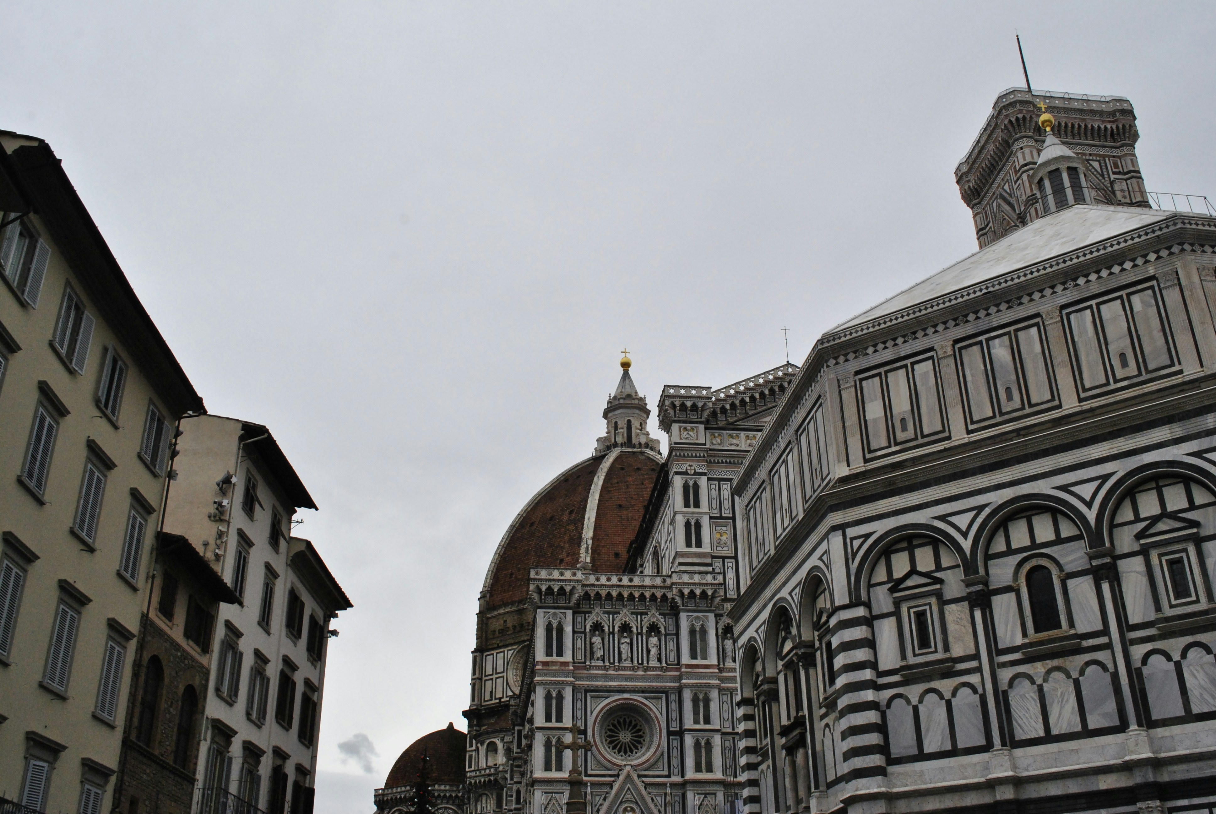 Cathedral Silhouettes Beneath a Skieswept Italian Rooftop