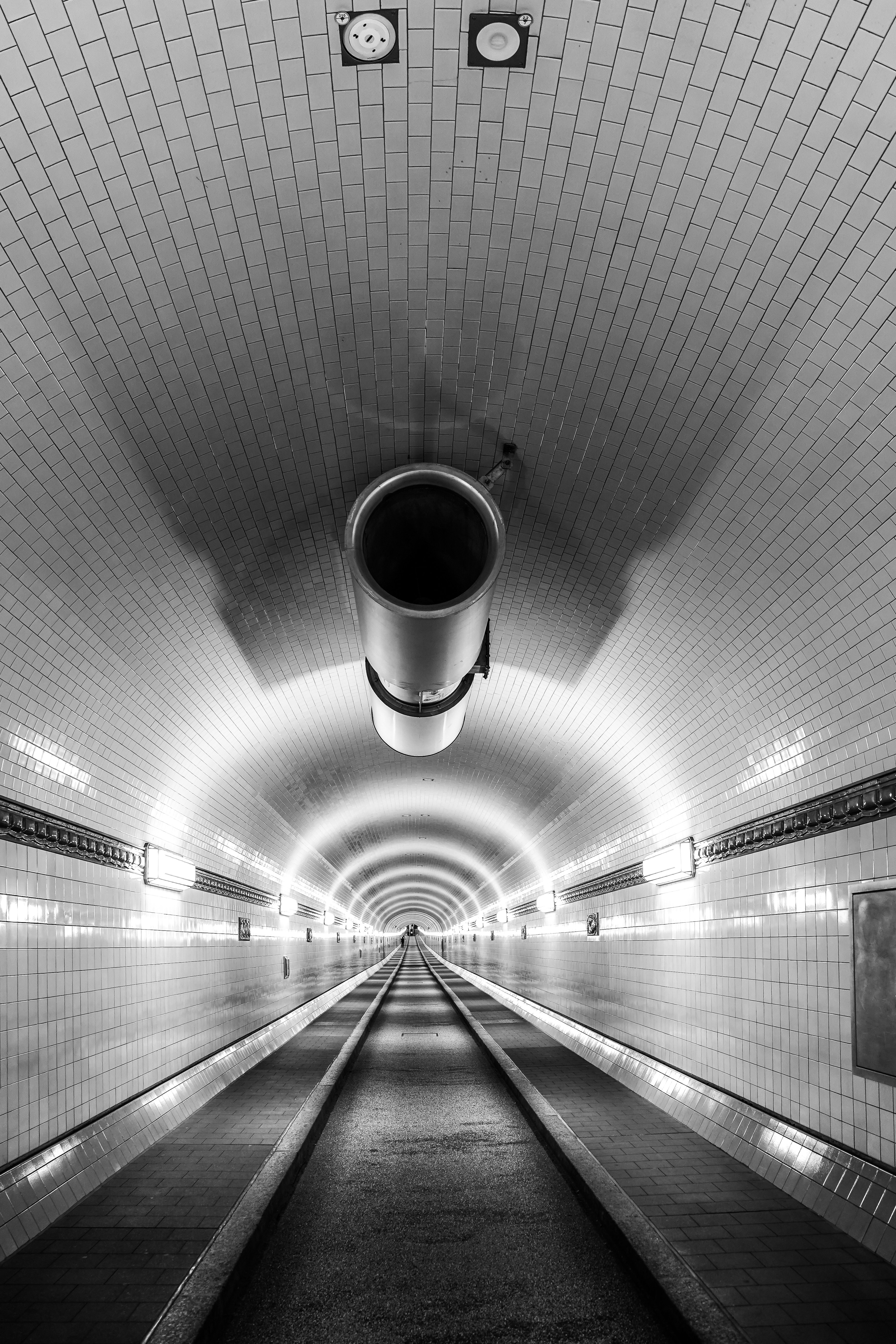 Tunnel of Light: A Central Conductor Descends the Subway Arc