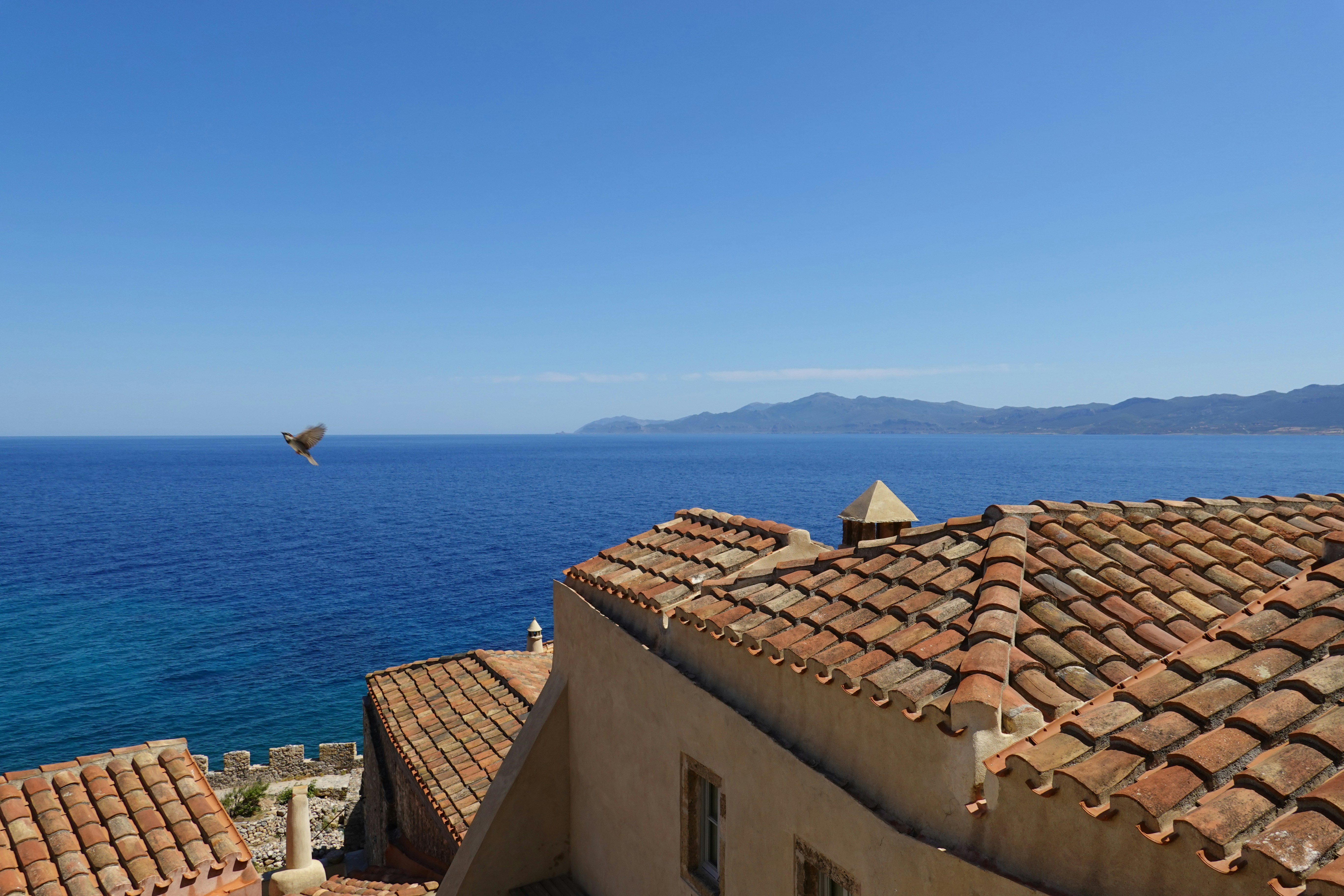 Terracotta Rooftops Lookout Over Aegean Horizon