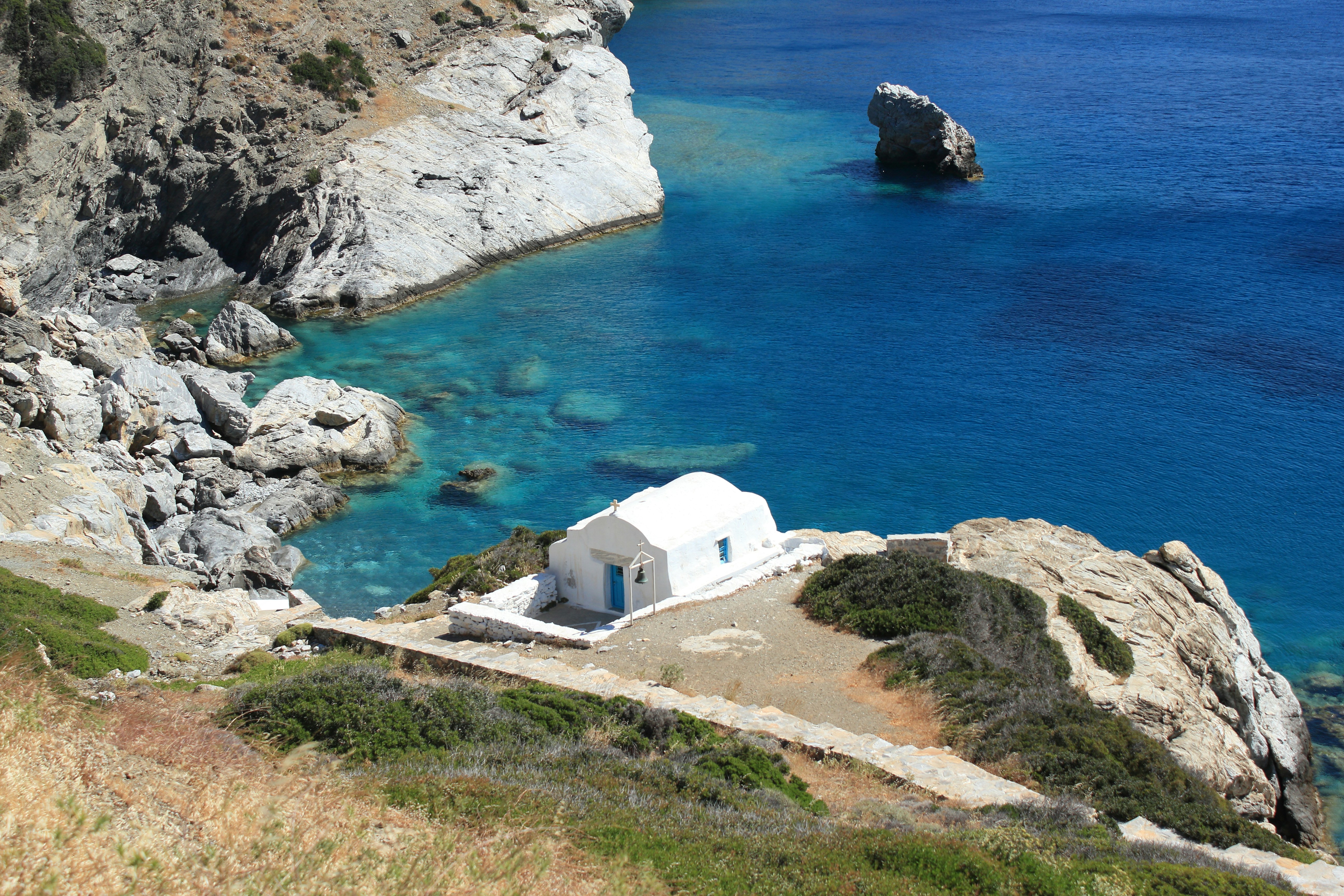 White Chapel at the Edge: A Cliffside Sanctuary Over Turquoise Waters