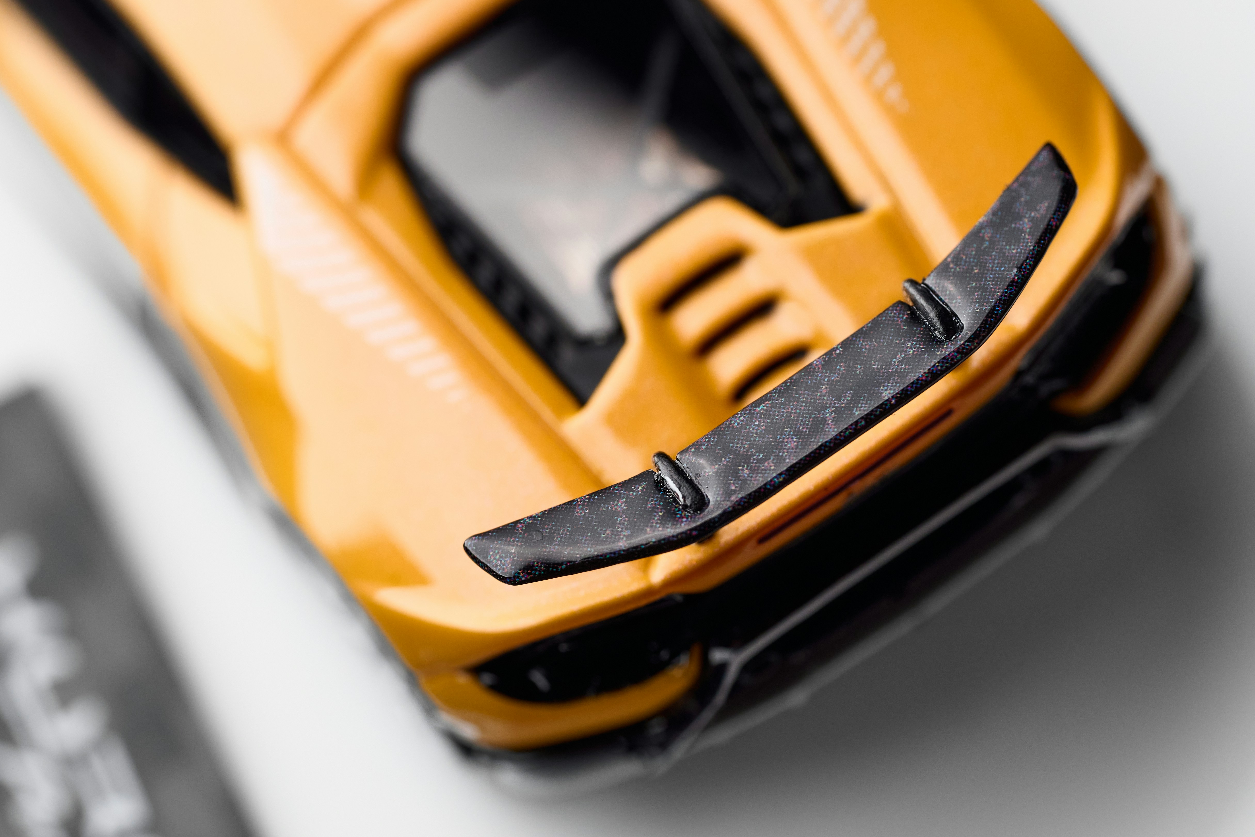Orange RC Car Hood Up-Crop: An Intimate Look at the Front Bumper Detail