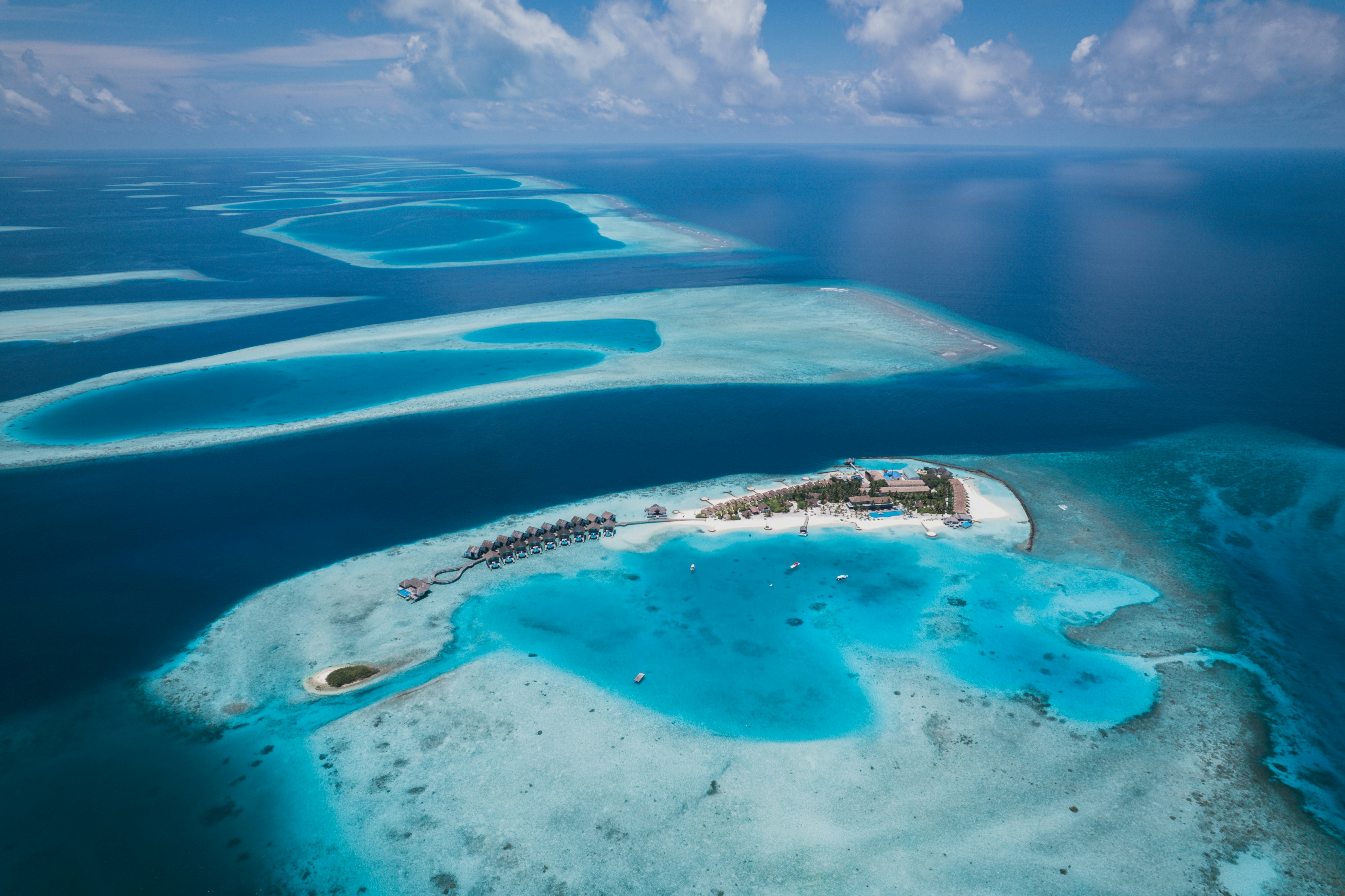 Turquoise Atoll: A Coral Strip Dotted with a Secluded Island