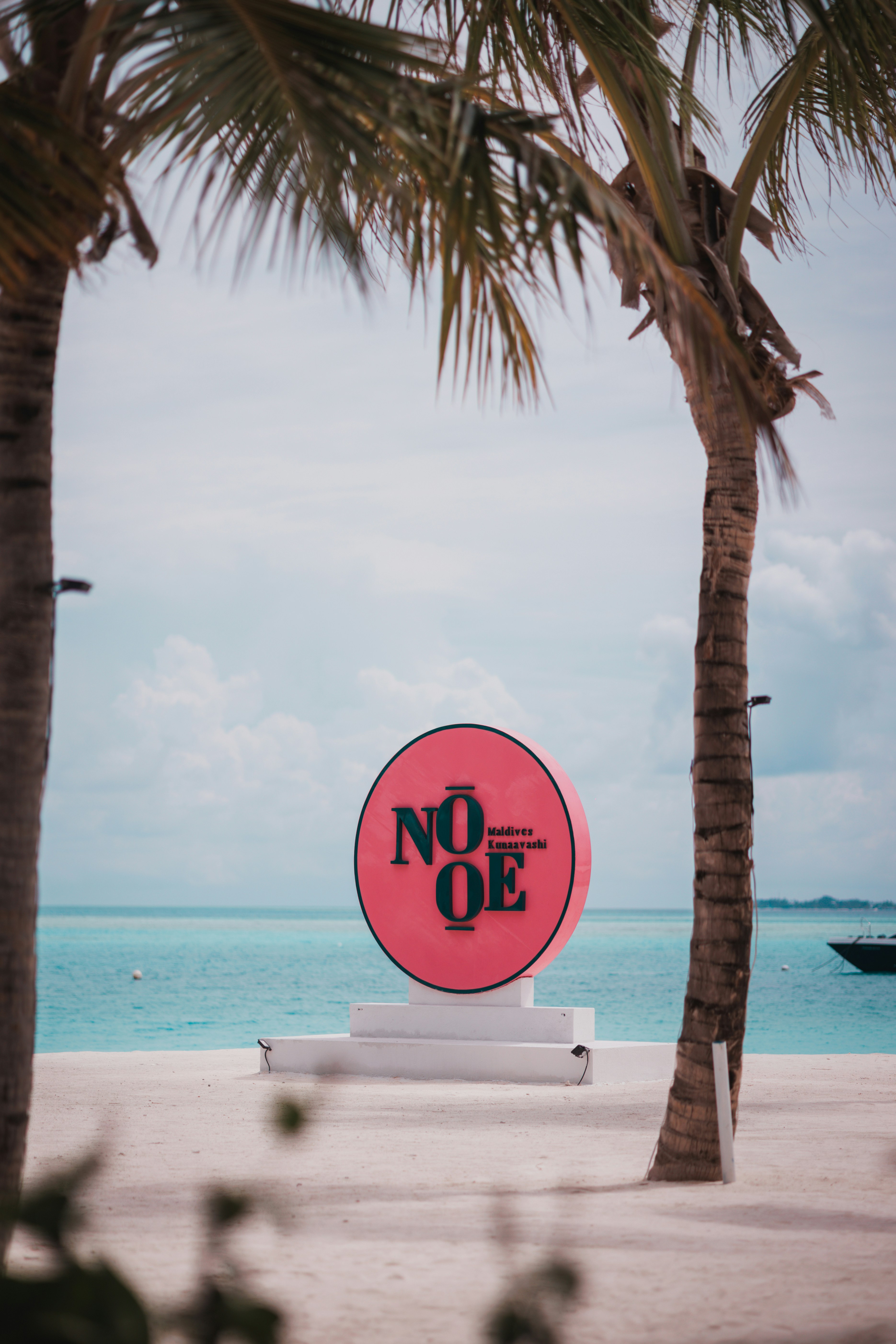 Pink No-Exit Sign on a Serene Maldivian Beach