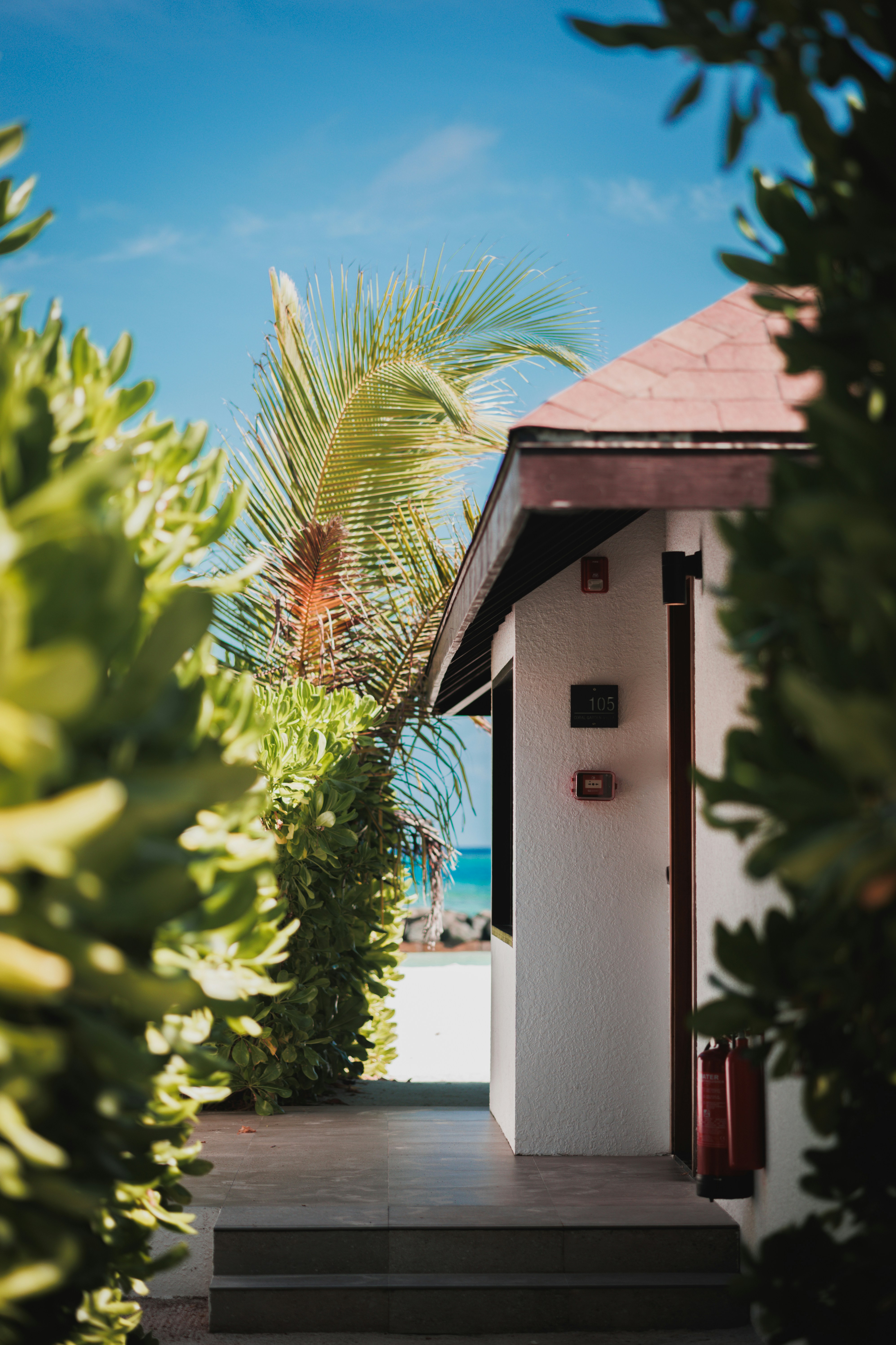 Tropical Villa Entrance Framed by Lush Greenery