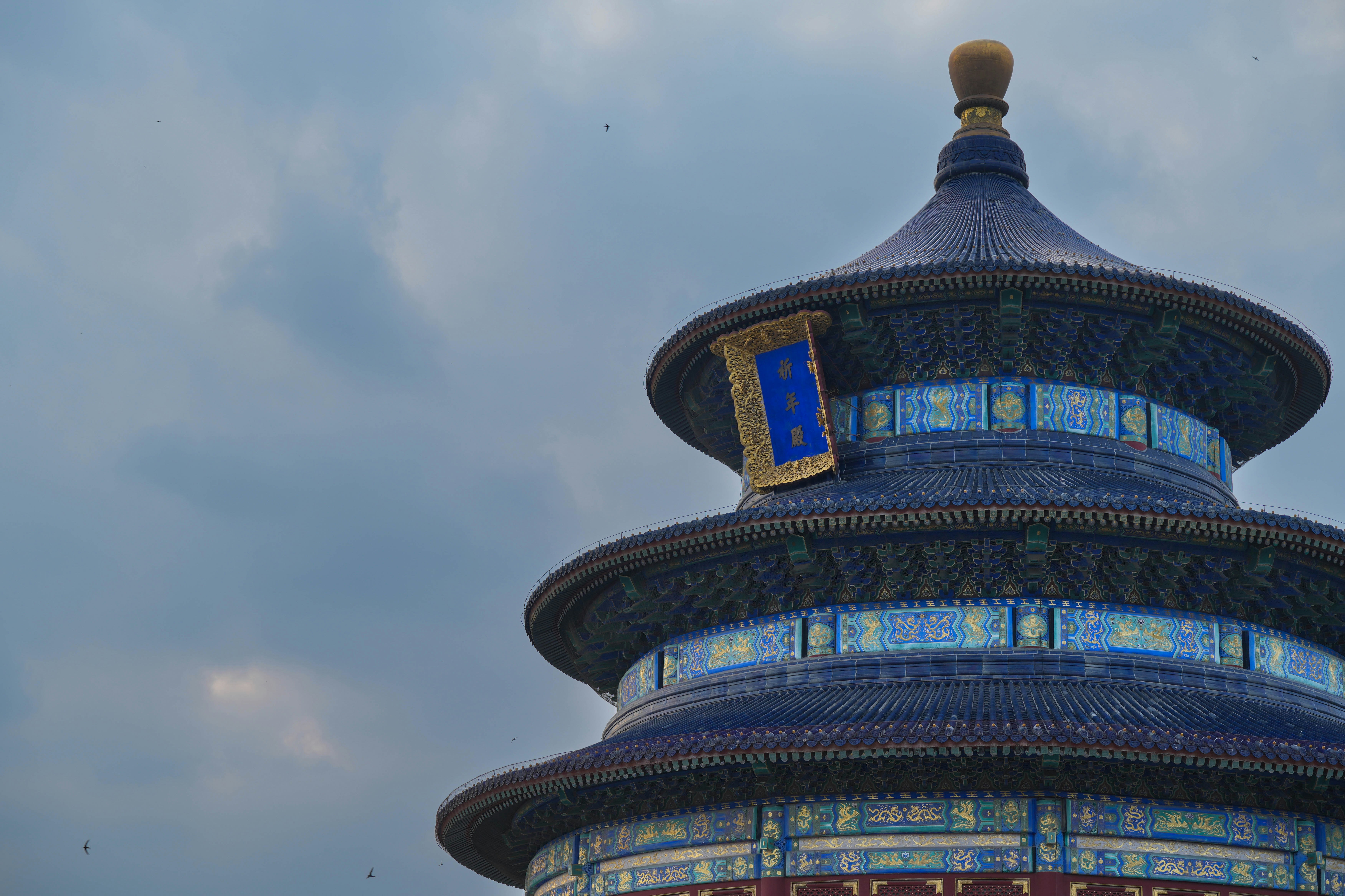 Blue-tiled Three-Tier Temple: A Skyward Gaze at a Chinese Pagoda