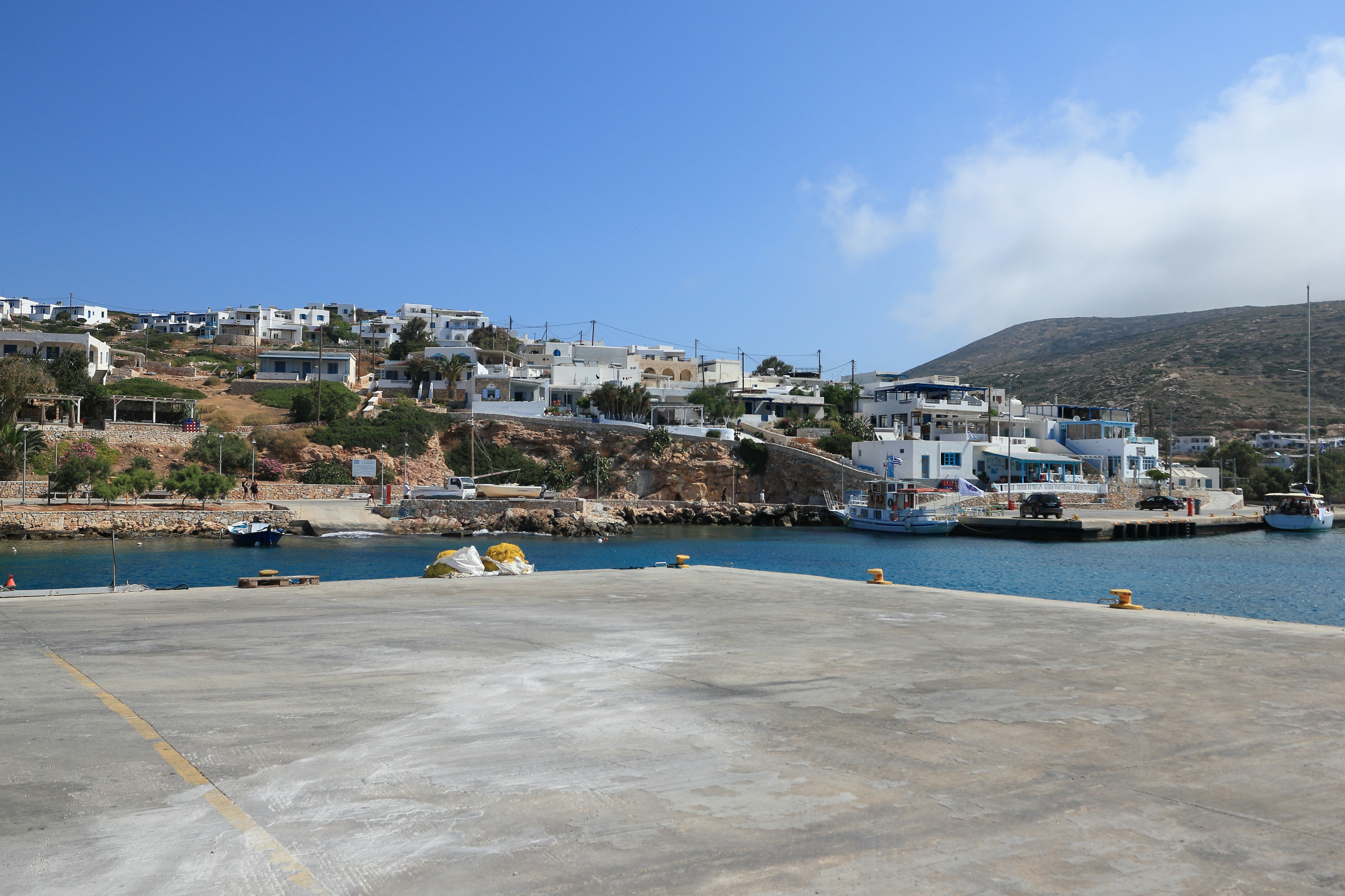Harbor Terrace: A Quiet Concrete Forecourt Looking Toward Whitewashed Dwellings