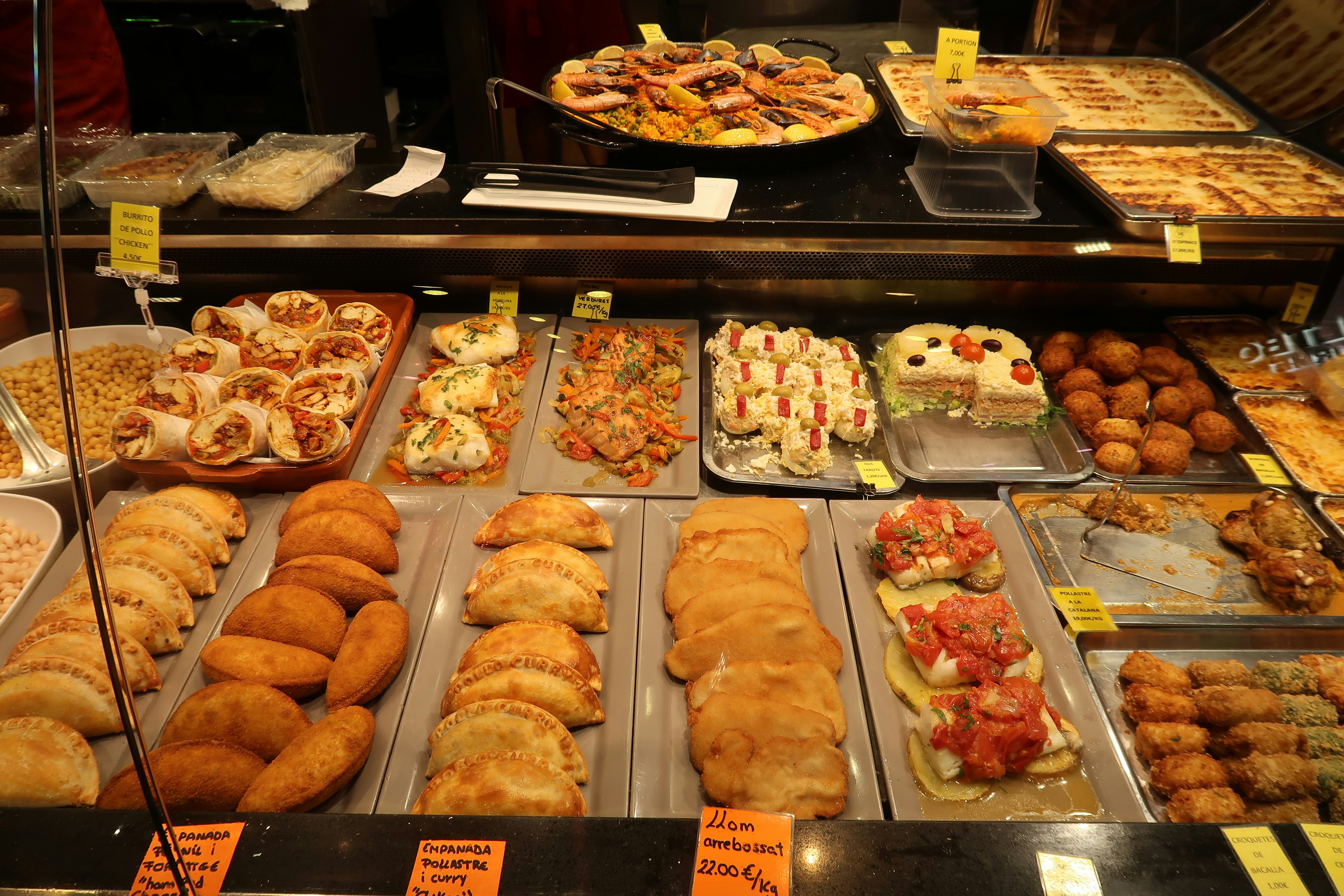 Row of Pastry Plates in a Golden Bakery Display