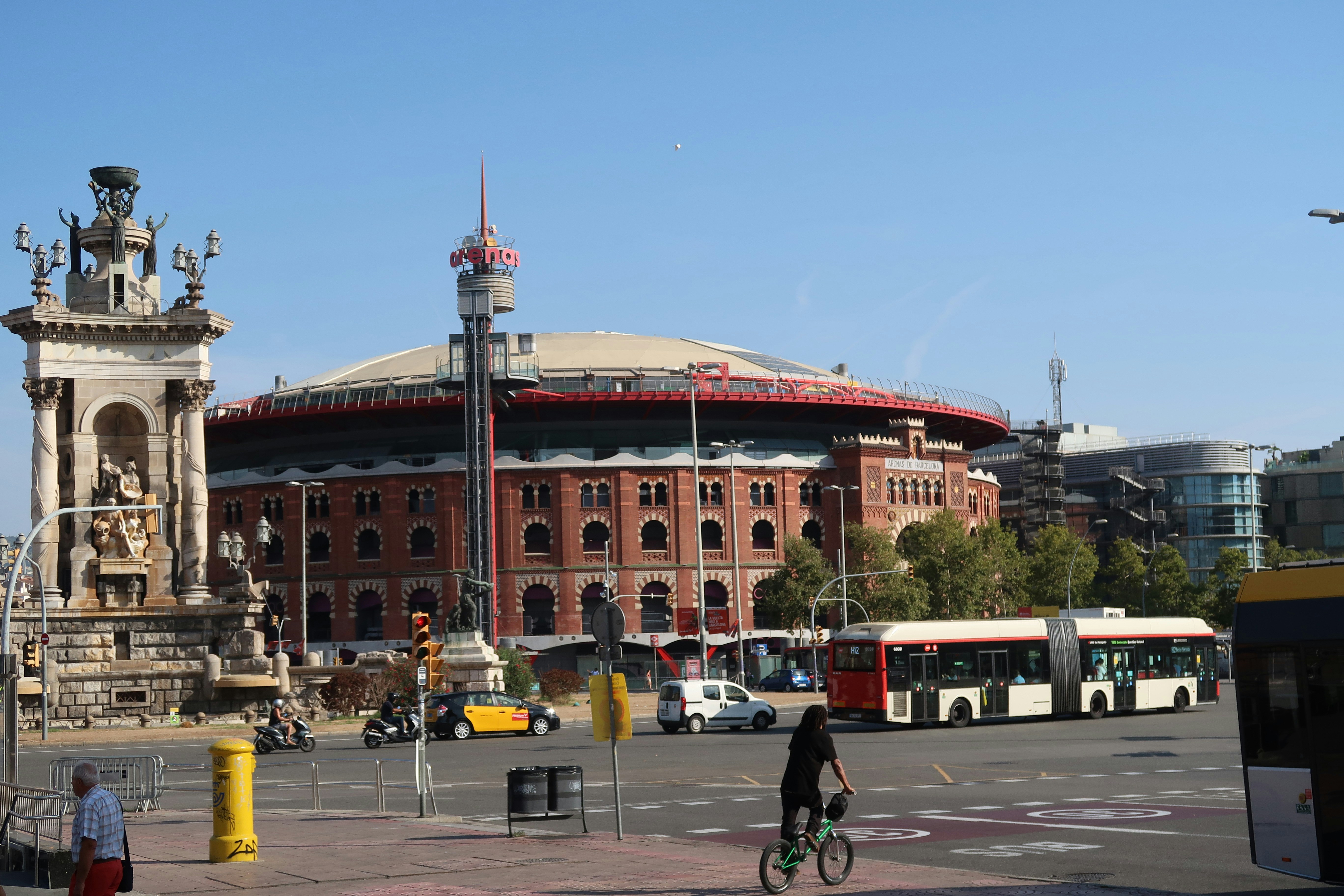 Circular Arena by the Park: A City Square under a Clear Sky
