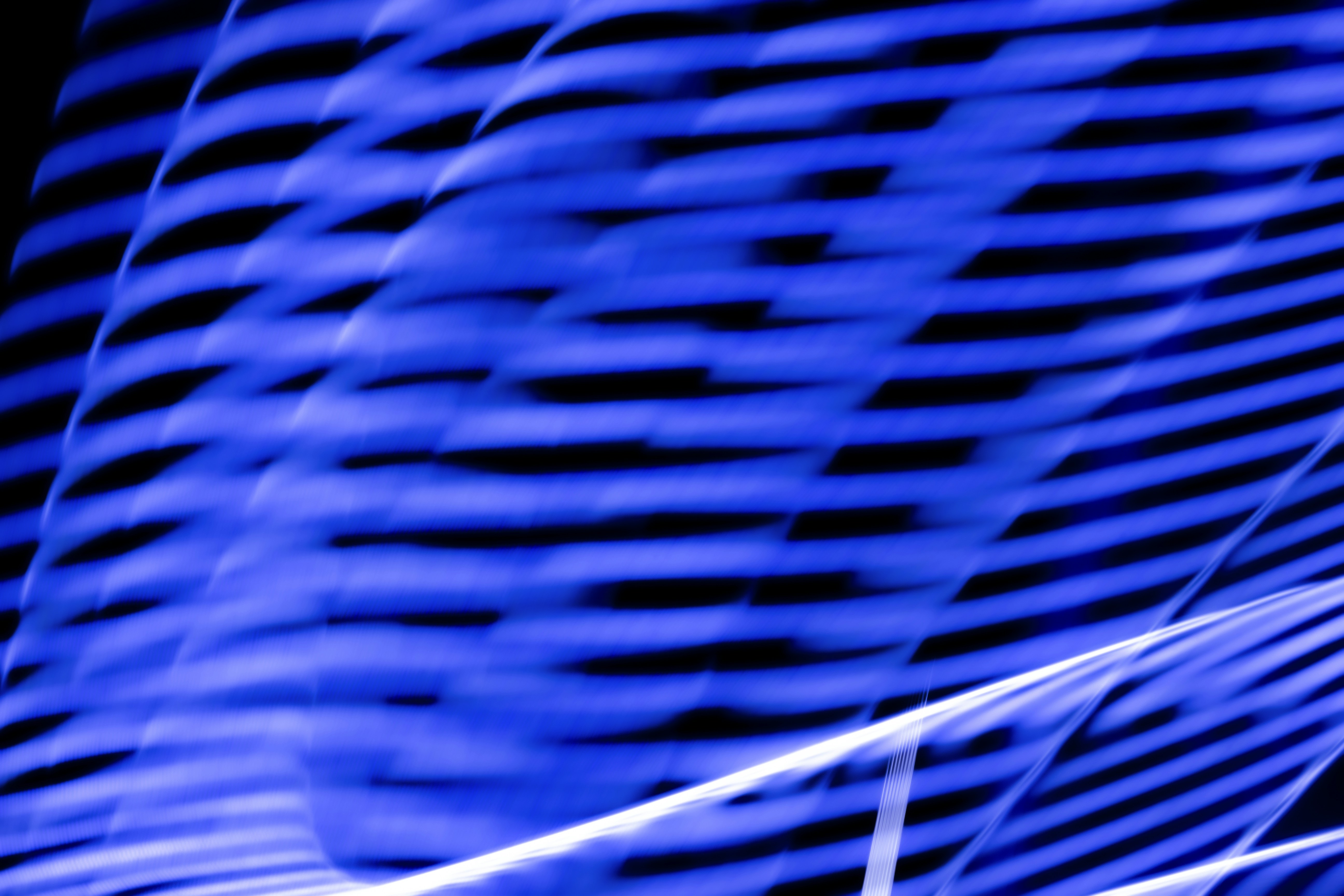 Blue Lattice in Motion: Interwoven Strands of Light