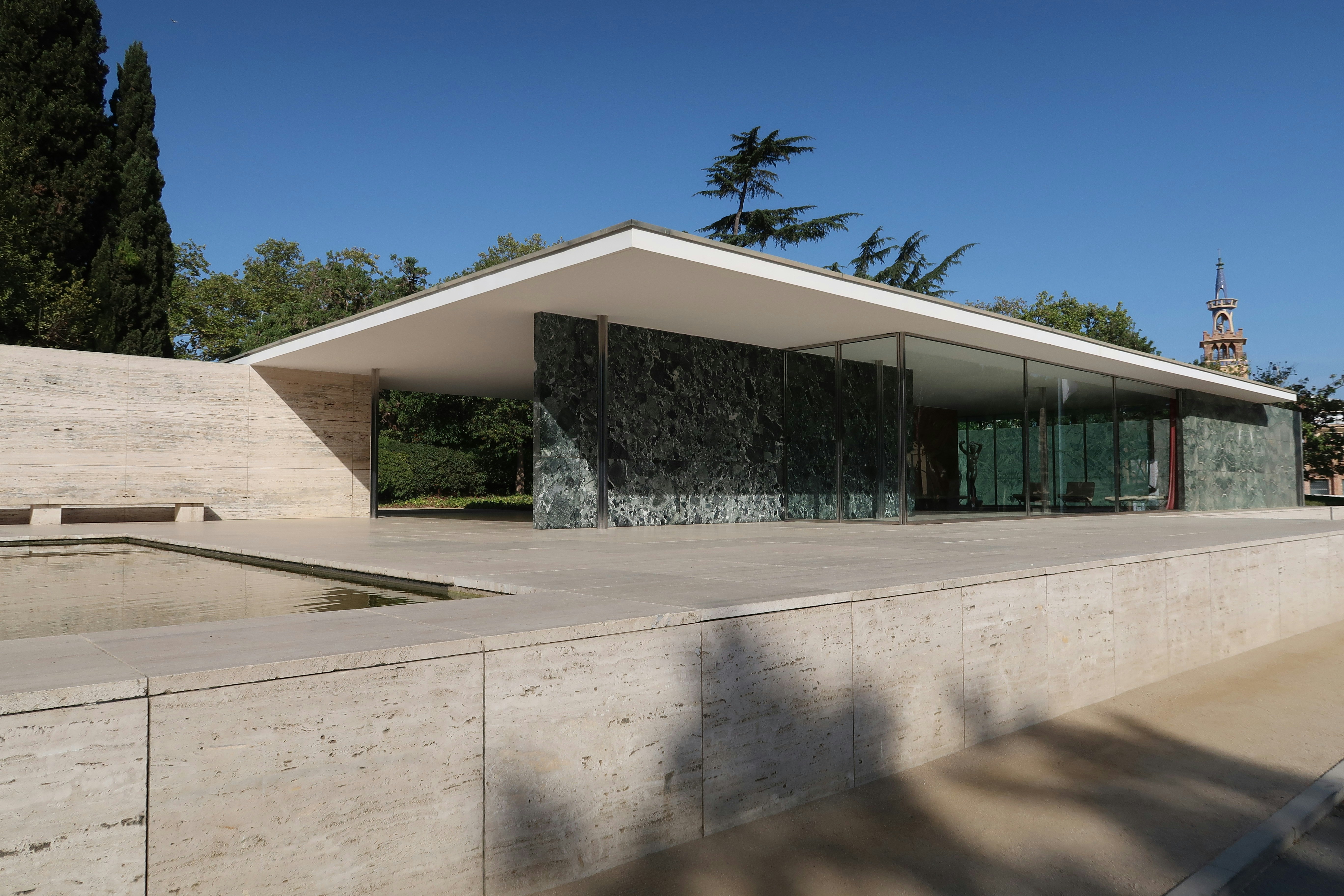 Midcentury Glass and Stone Pavilion Beyond a Quiet Terrace