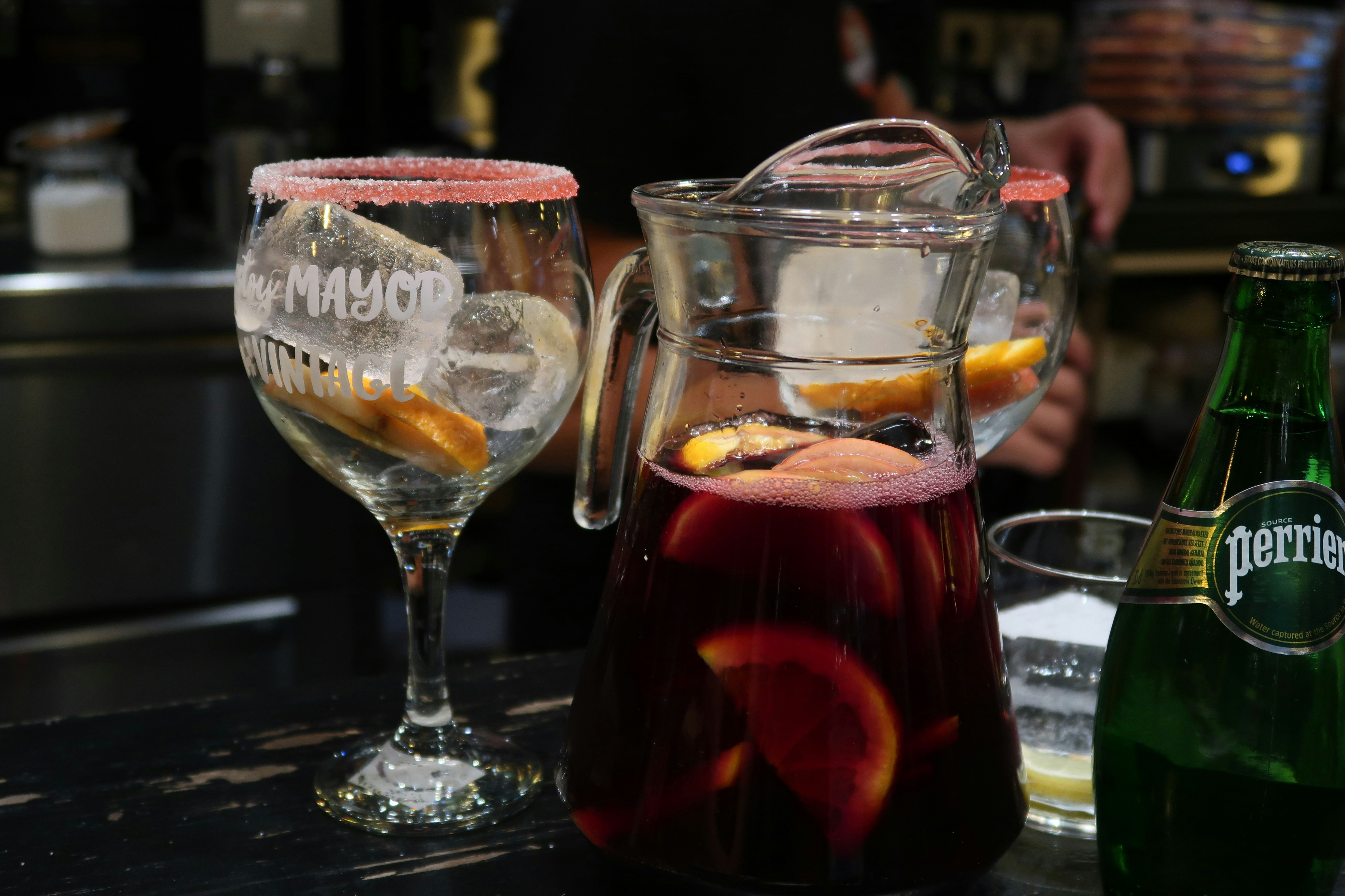 Citrus Sangria Portrait at a Dimly Lit Bar