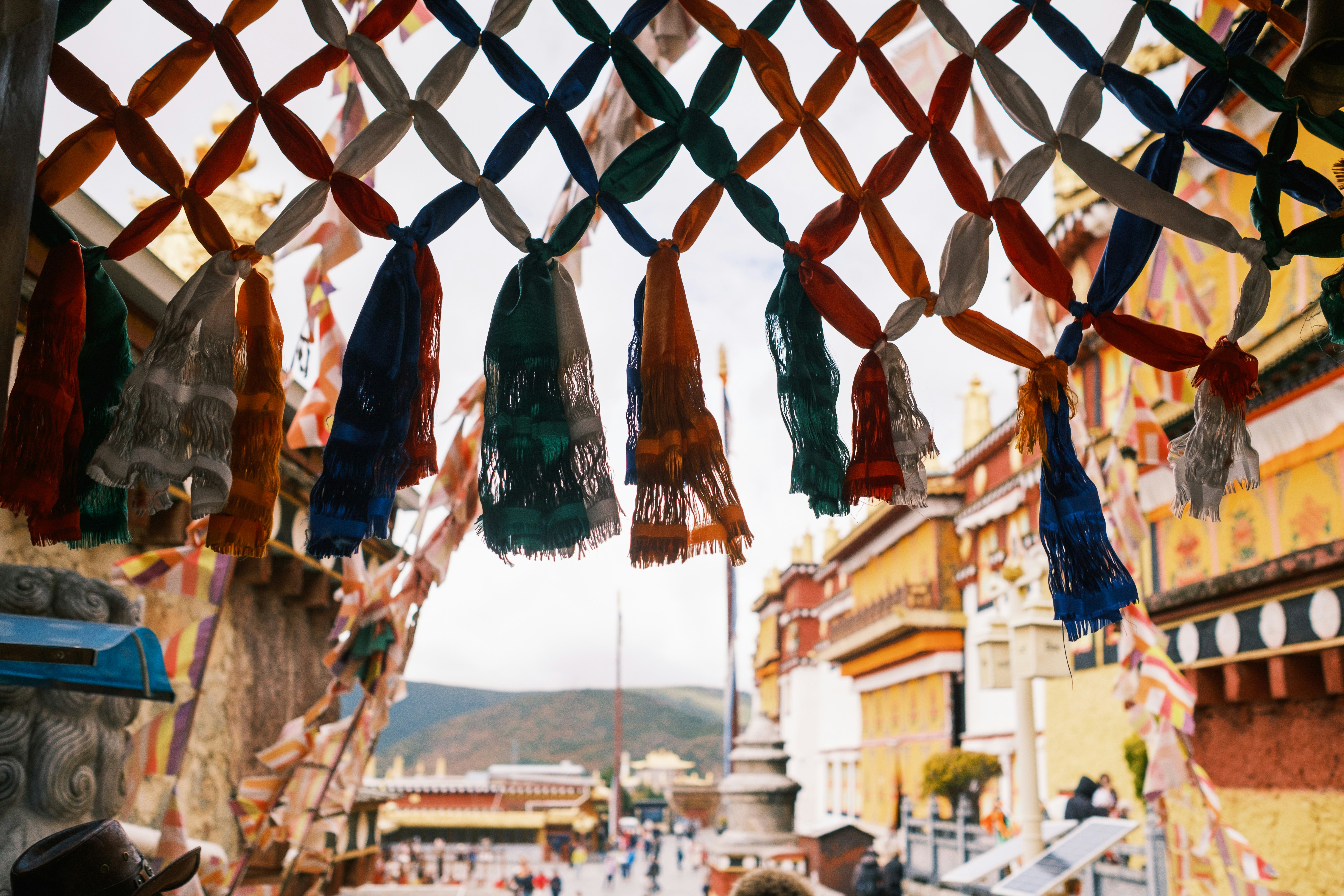 Prayer Flags Framing a Himalayan Temple Courtyard