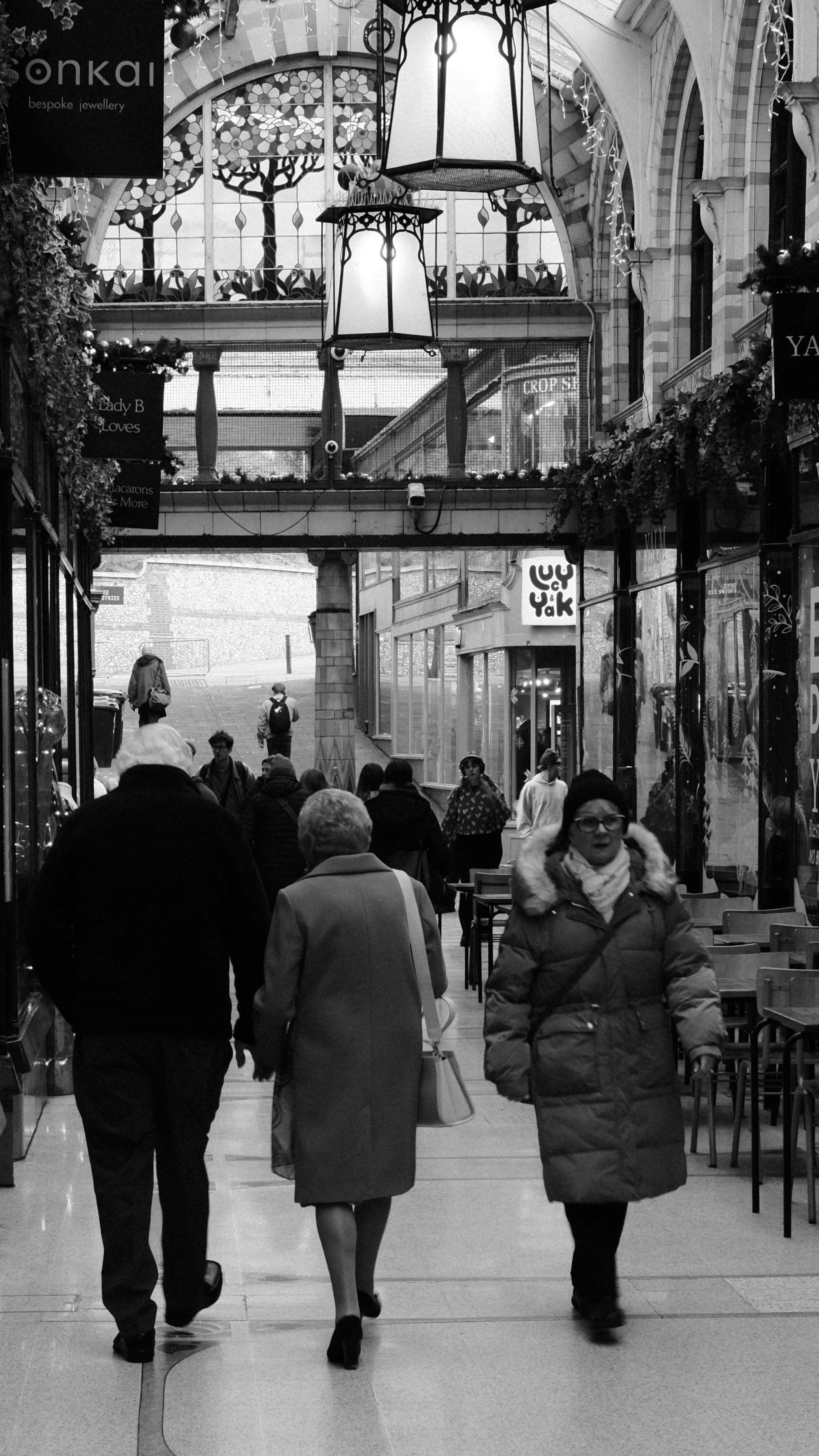 Shadows and Lanterns in a Cold City Passage