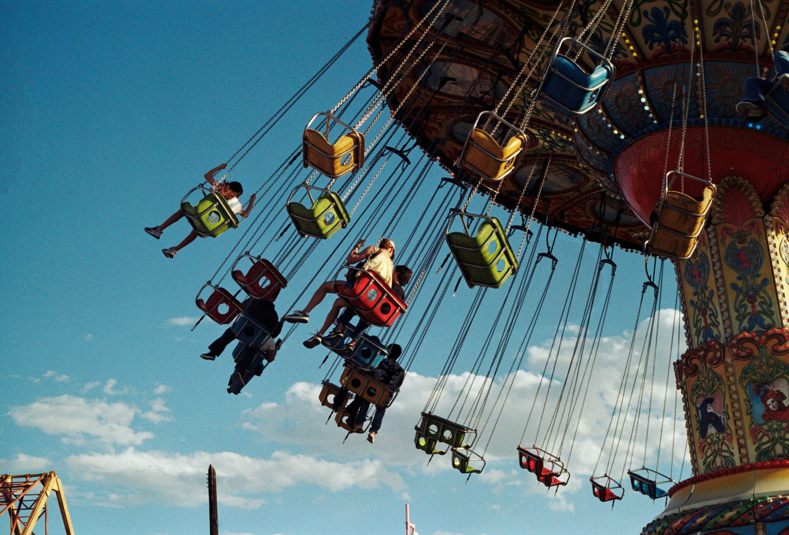 Choreography in the Sky: Riders in a Candy-Colored Swing Ride